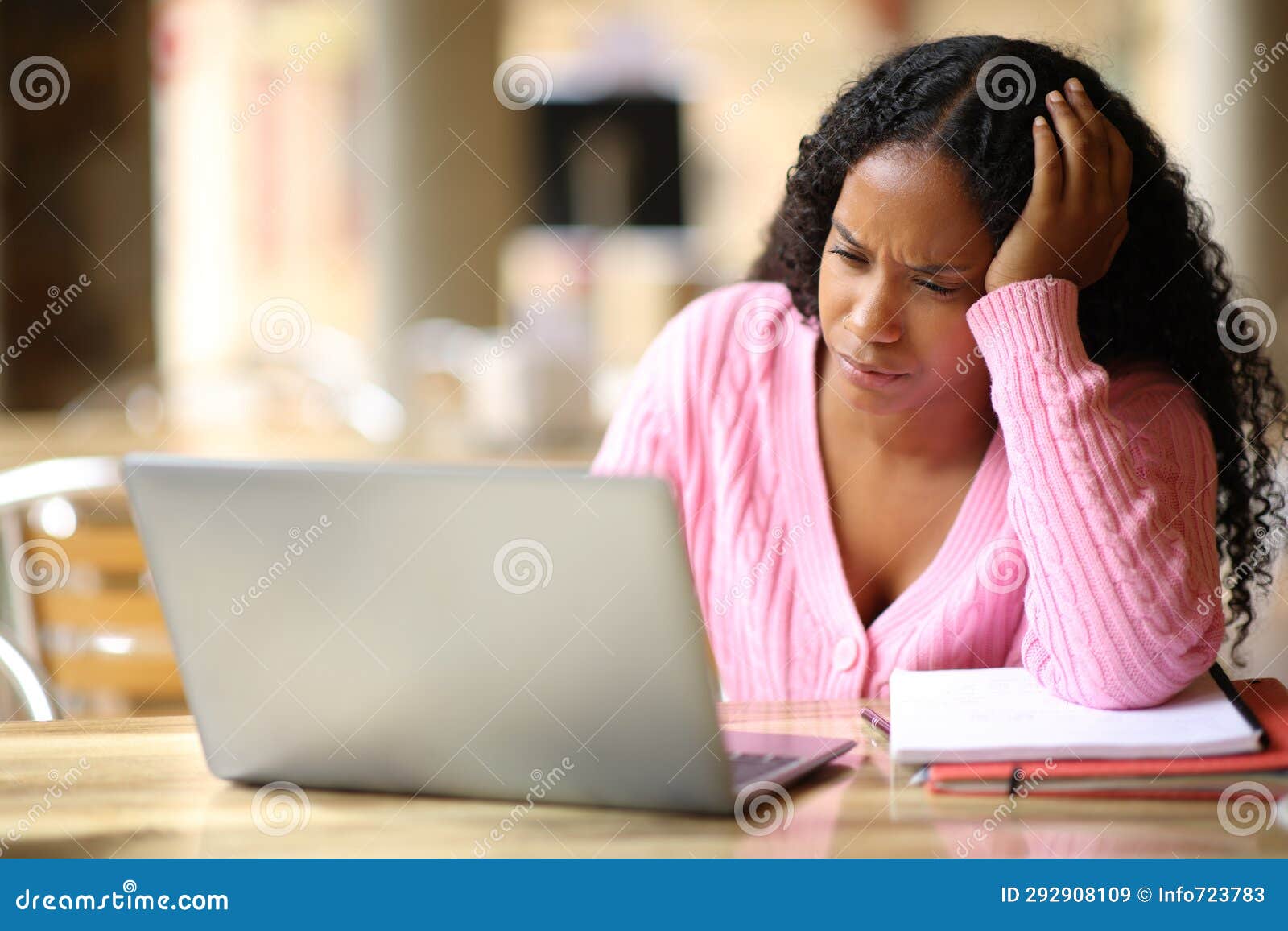 Confused Student Checking Laptop in a Bar Stock Image - Image of ...