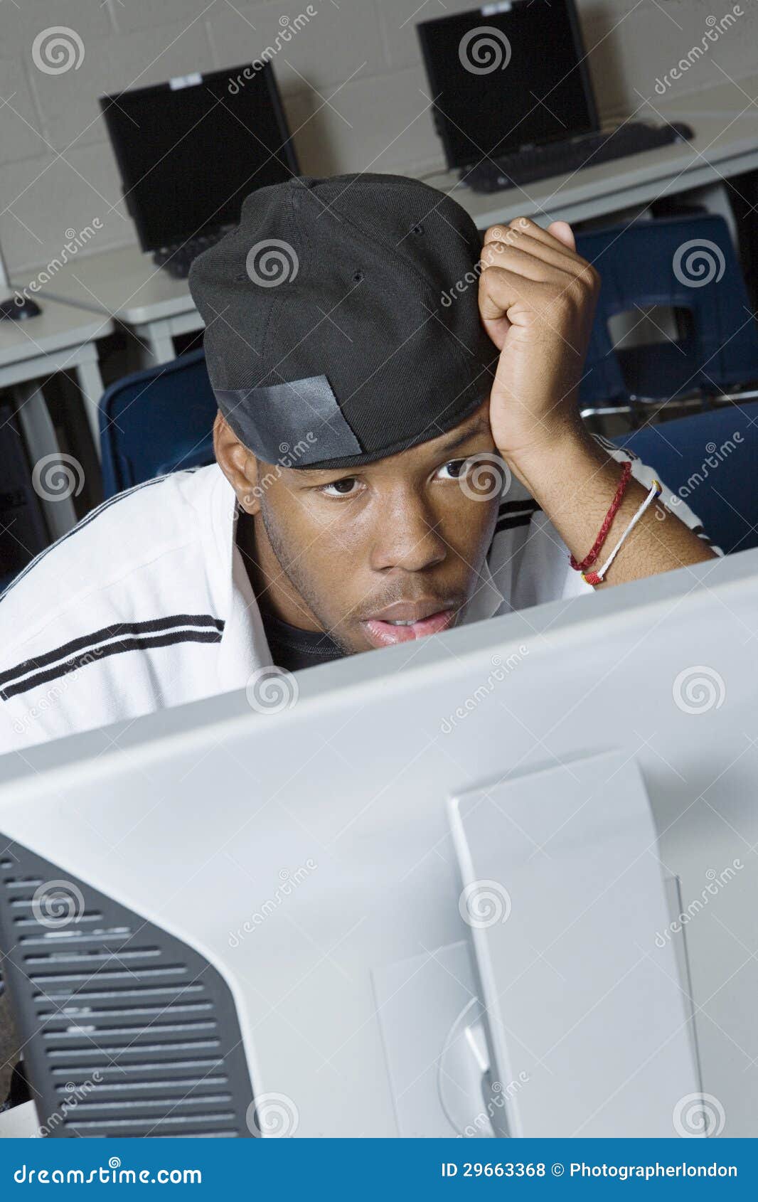Confused Student Looking at Computer Screen Stock Photo - Image of ...