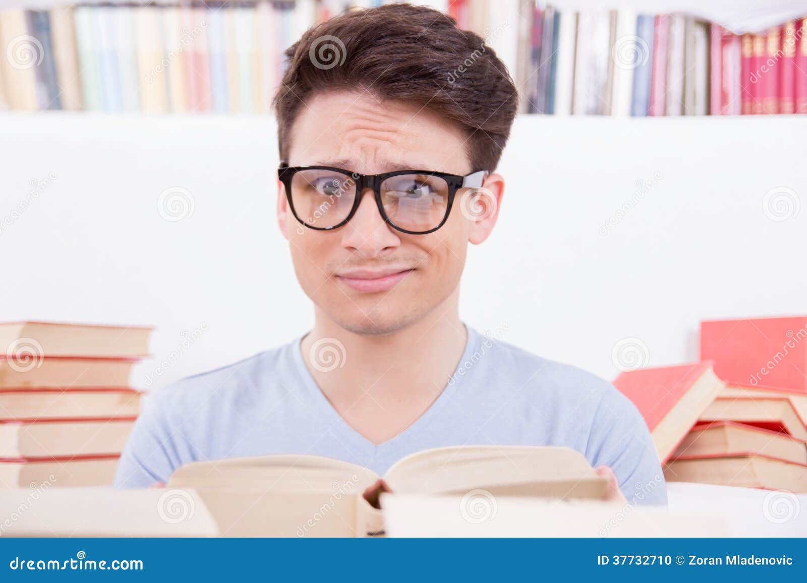 Confused Student Surrounded by Books Stock Photo - Image of essay ...