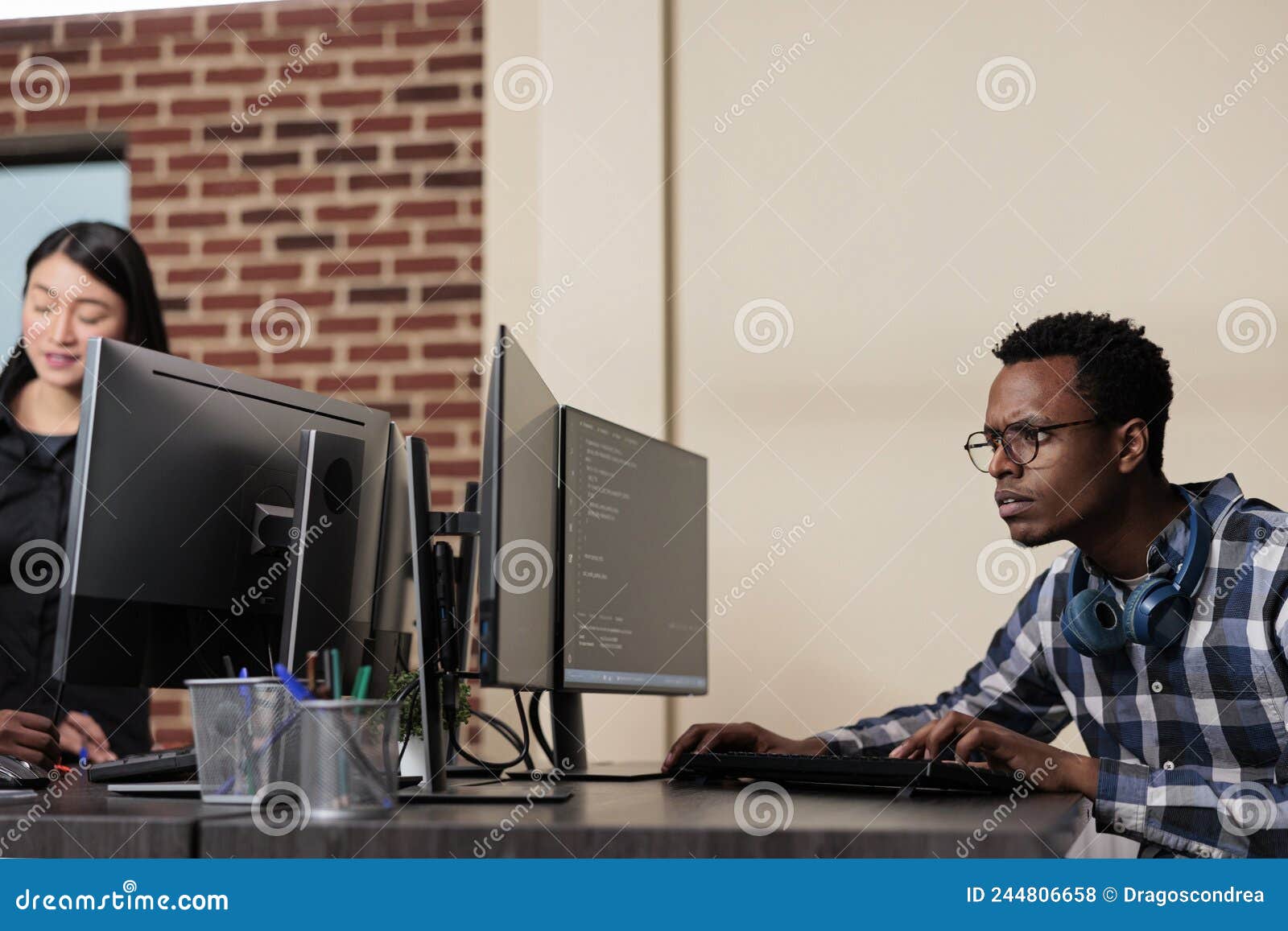 Confused Tech Engineer Sitting Doubtful at Computer Trying To Solve ...