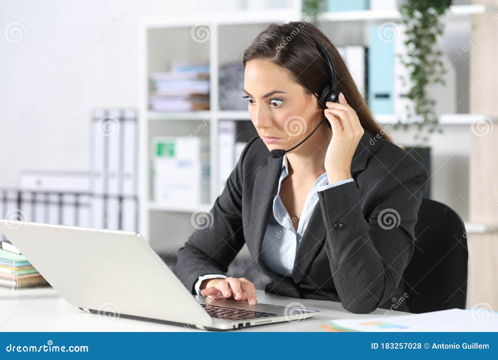 Confused Telemarketer Looking at Laptop at Office Stock Photo - Image ...