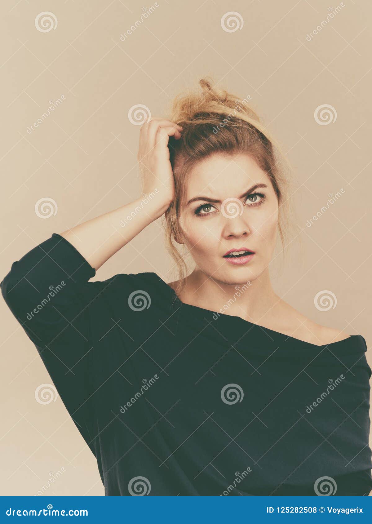 Confused Young Blonde Woman Thinking Stock Photo - Image of mind, idea ...