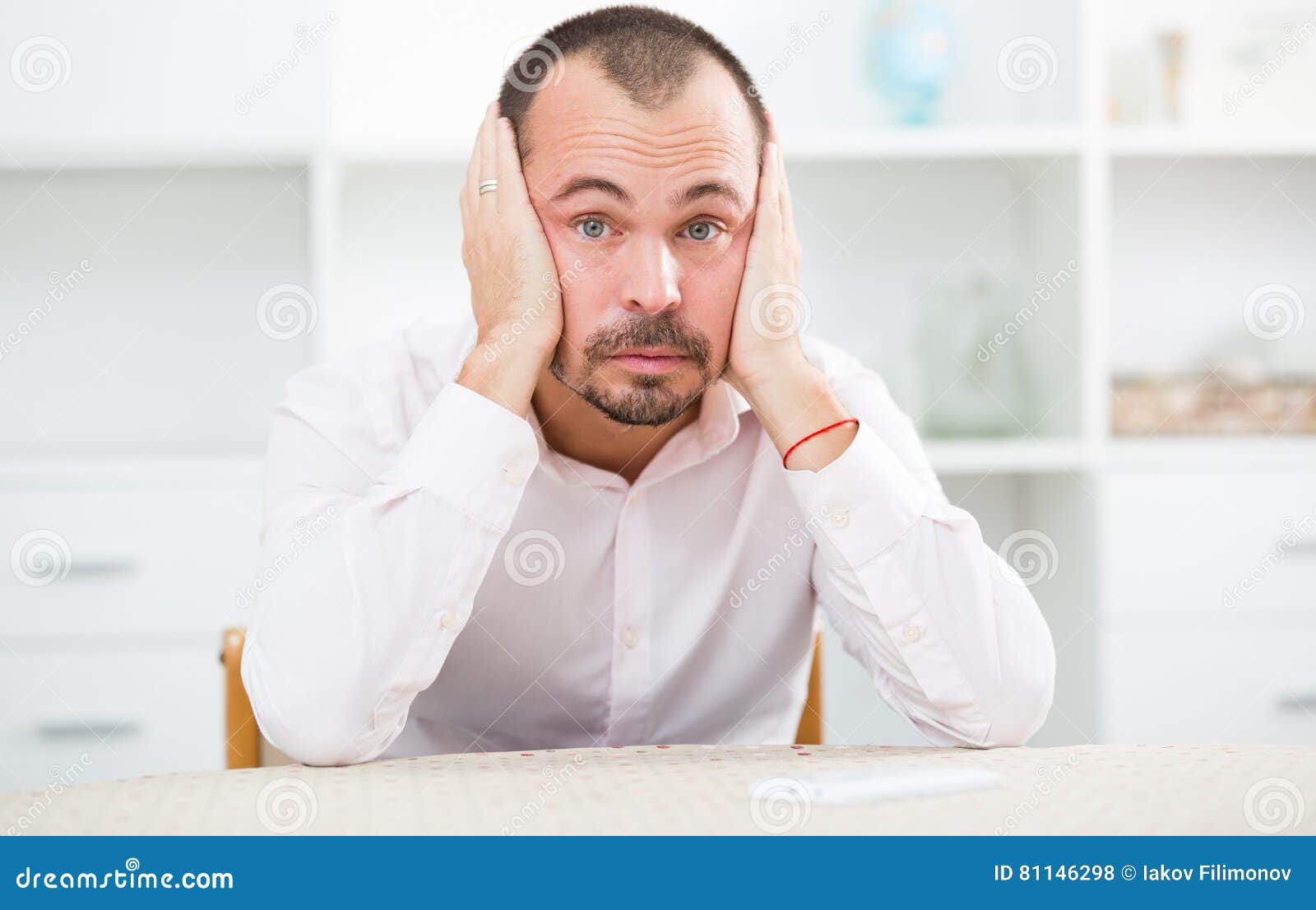 Confused Young Man at Workplace Stock Photo - Image of melancholy ...