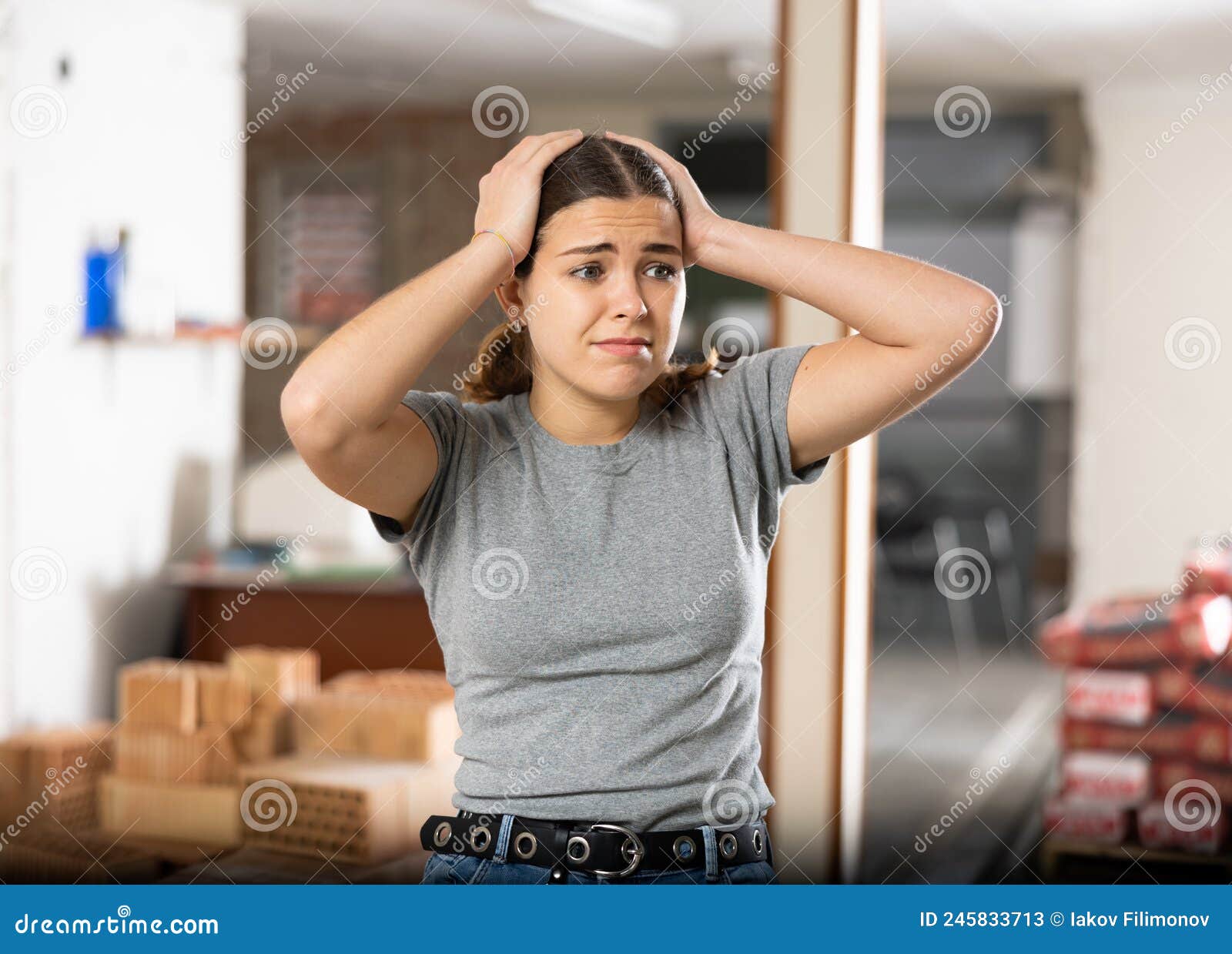 Confused Young Woman Standing in Her Apartment during Renovations Stock ...