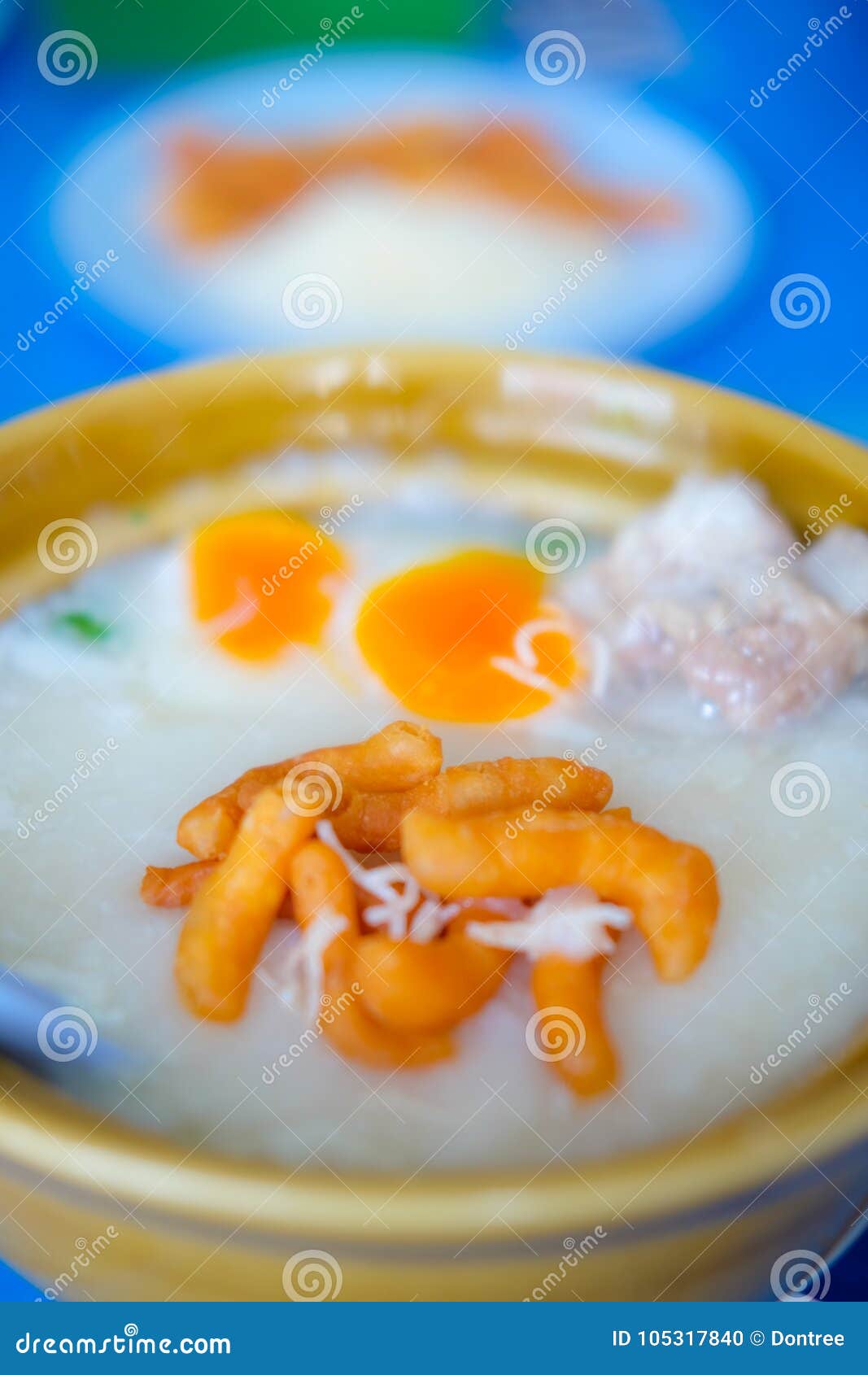 Congee on top with pork stock photo. Image of fried - 105317840