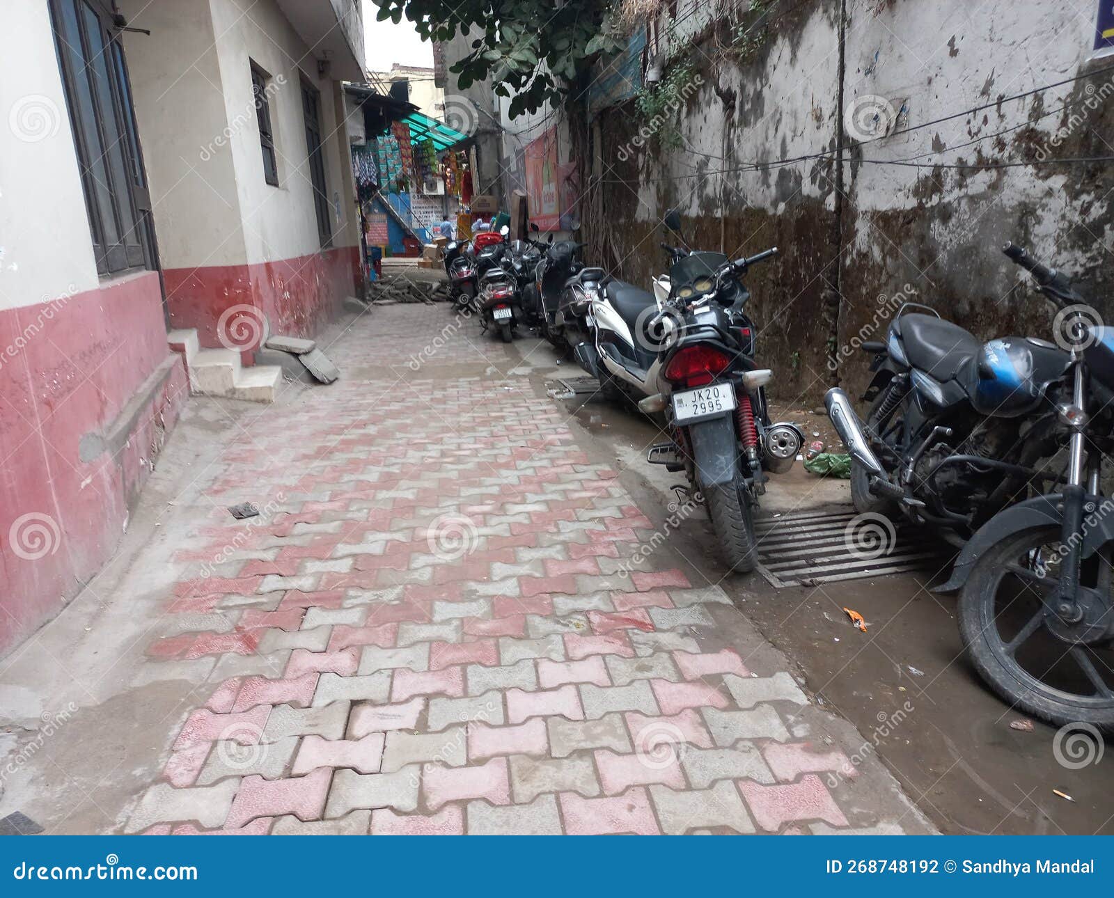 A Congested Path Lined with Irregularly Parked Two Wheeler Bikes ...