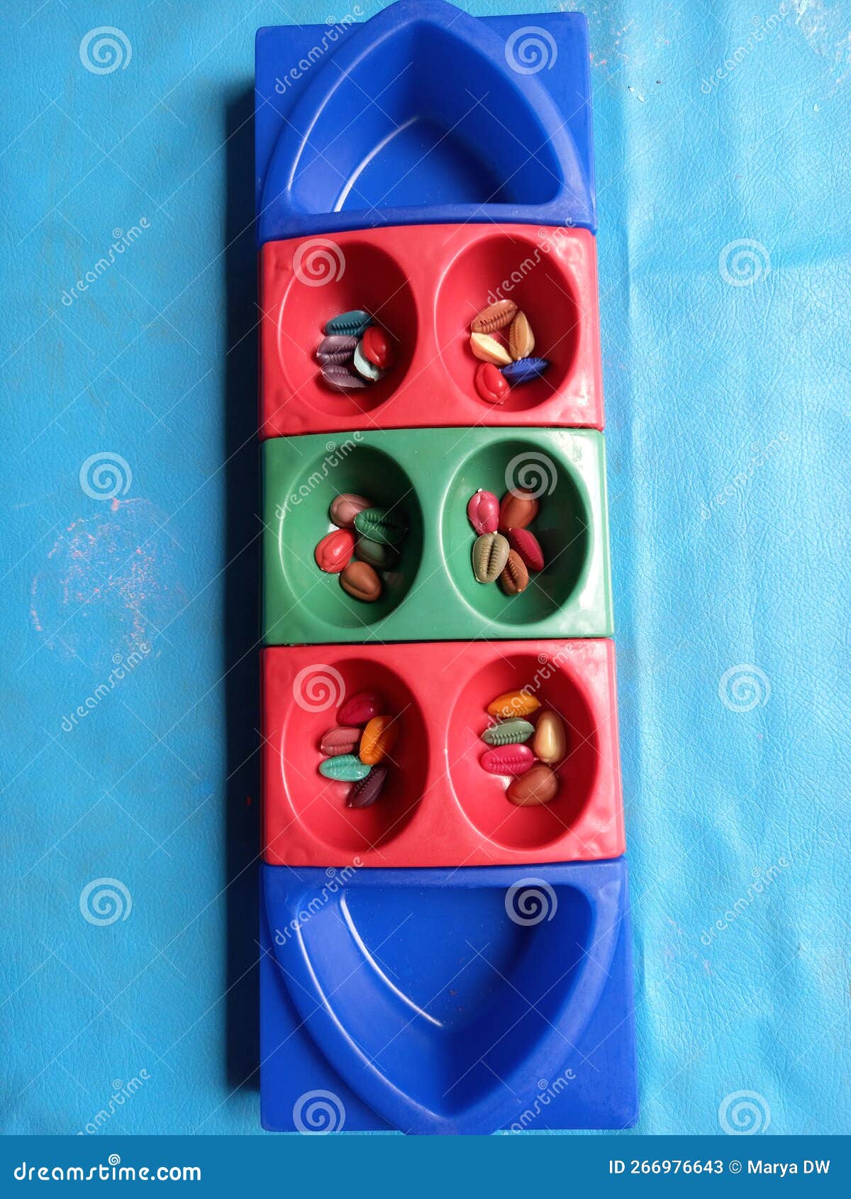 Congklak or Dakon stock image. Image of brand, purple - 266976643