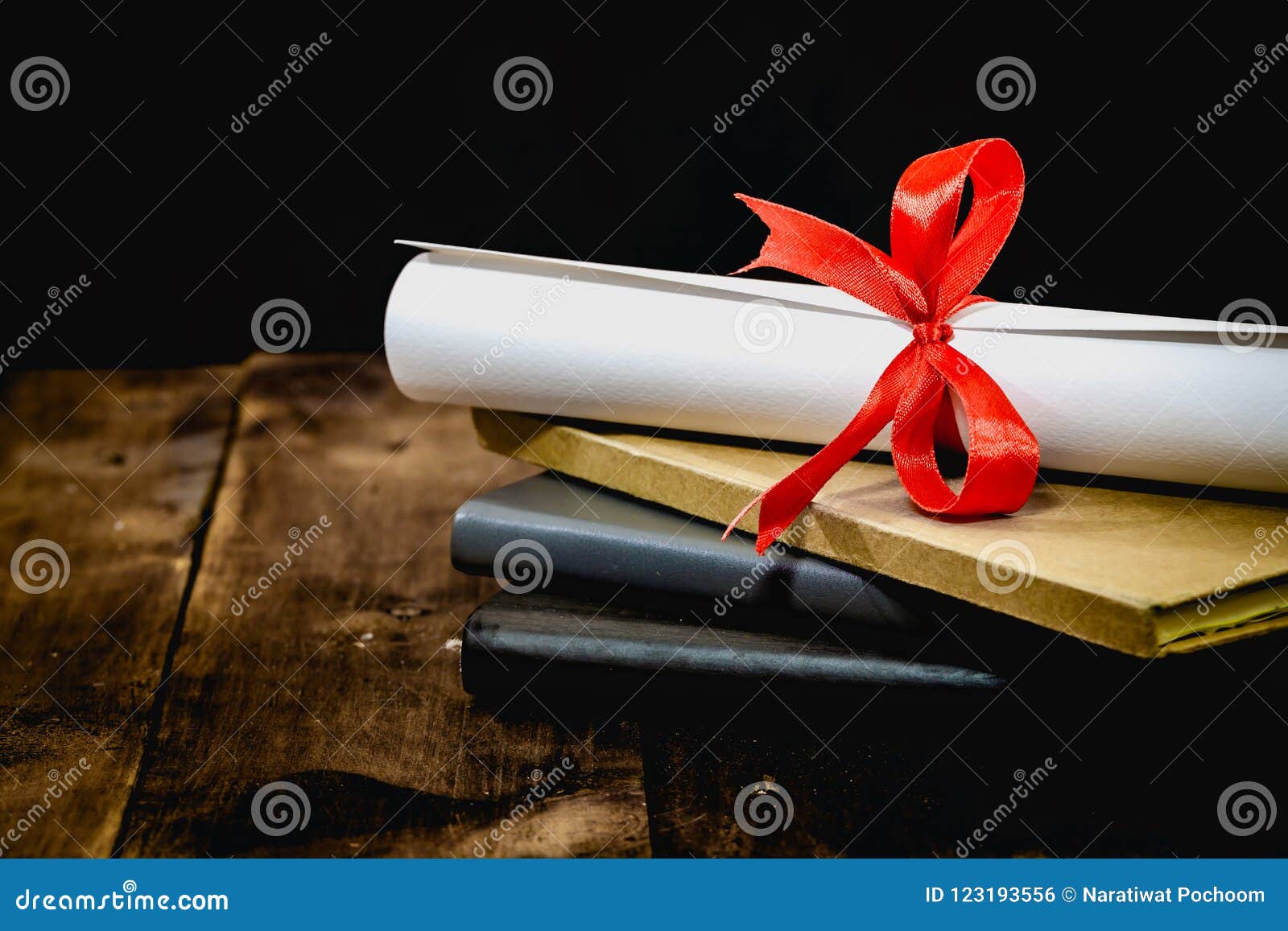 A Mortarboard And Graduation Scroll, Tied With Red Ribbon, On A Stock ...
