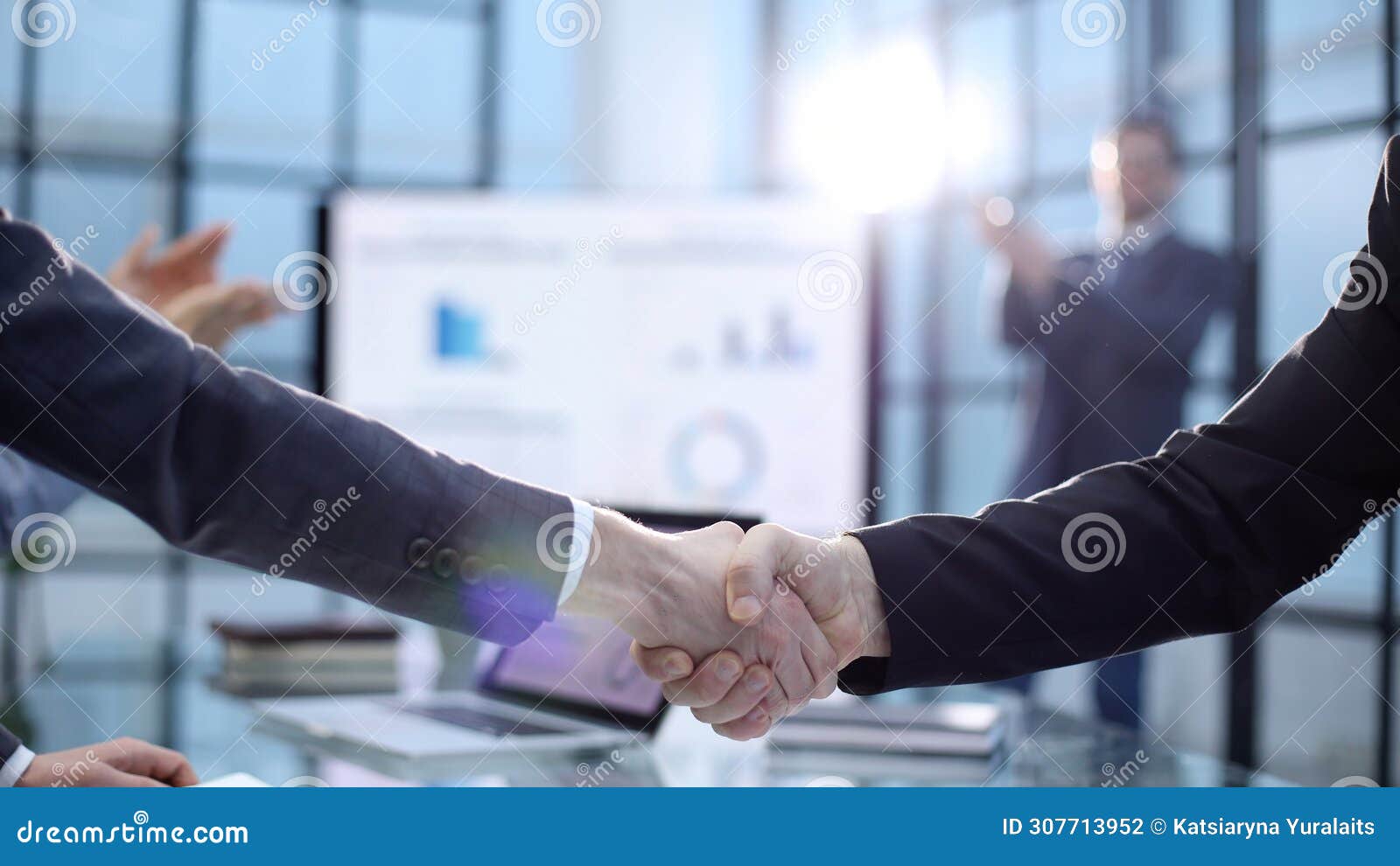 Congratulations on a Successful Deal with a Handshake Stock Photo ...