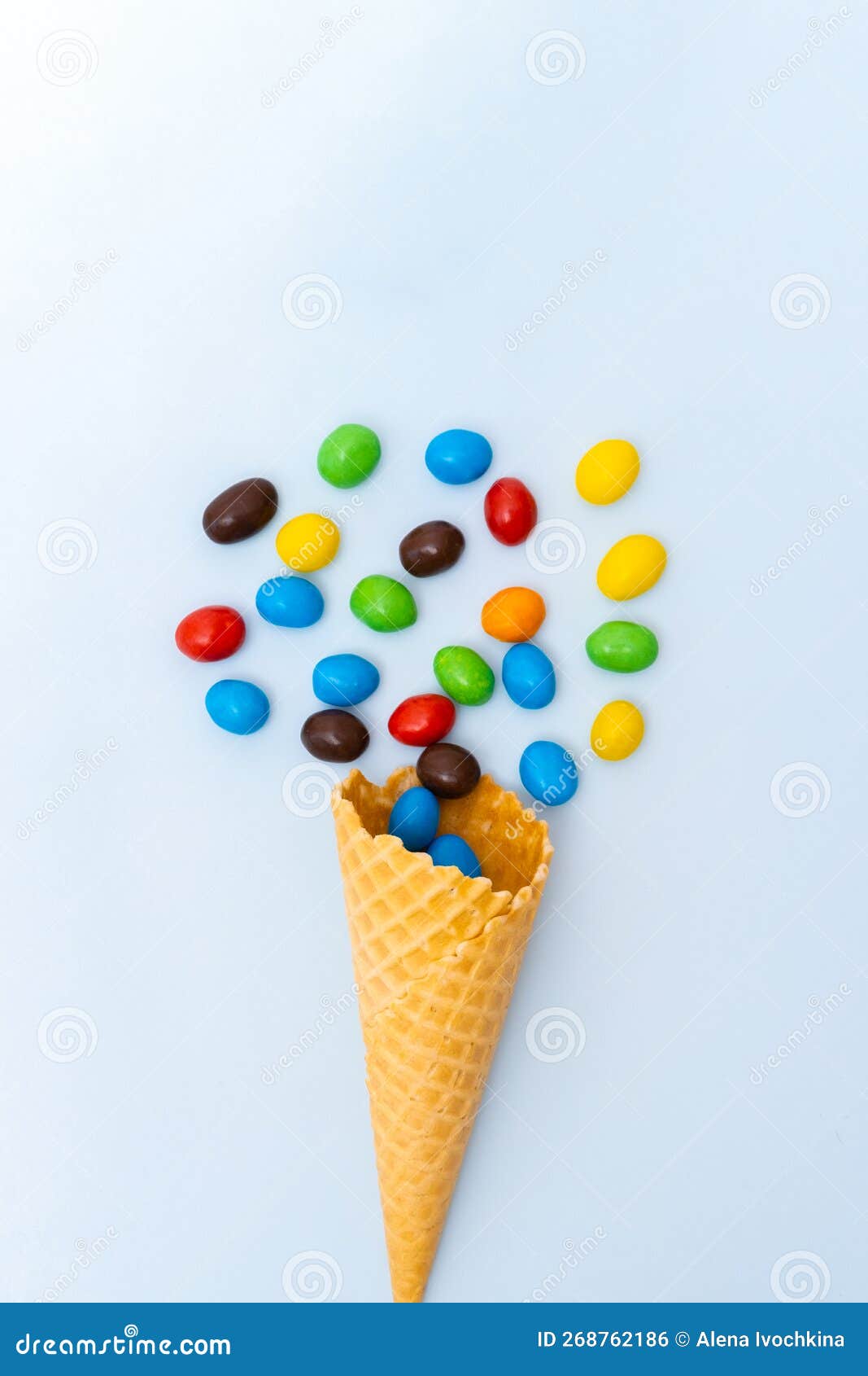 A Conical Empty Waffle Cone and Scattered Multicolored Round Candies ...