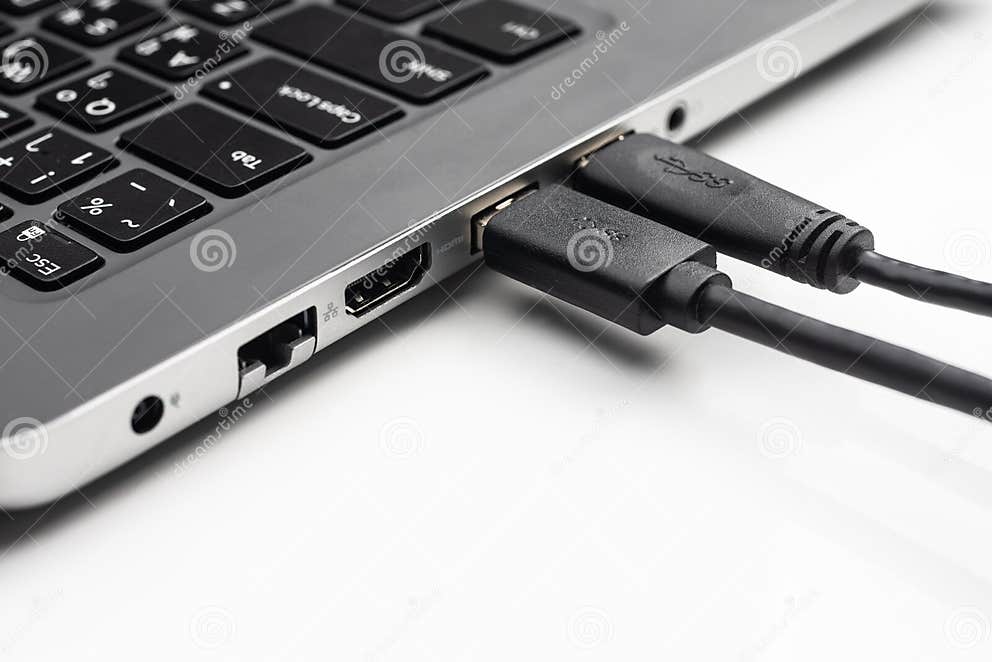 Connect a USB Cable To a Laptop Computer Notebook Computer on Stock ...