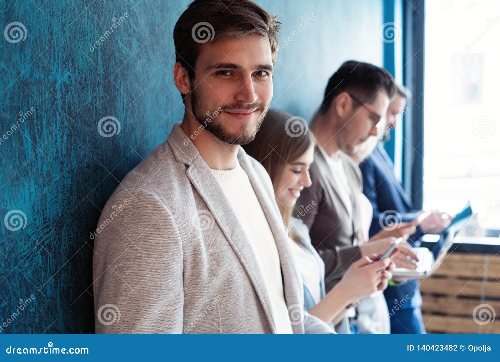 The Connected Team is an Efficient Team. Group of Businesspeople Using ...