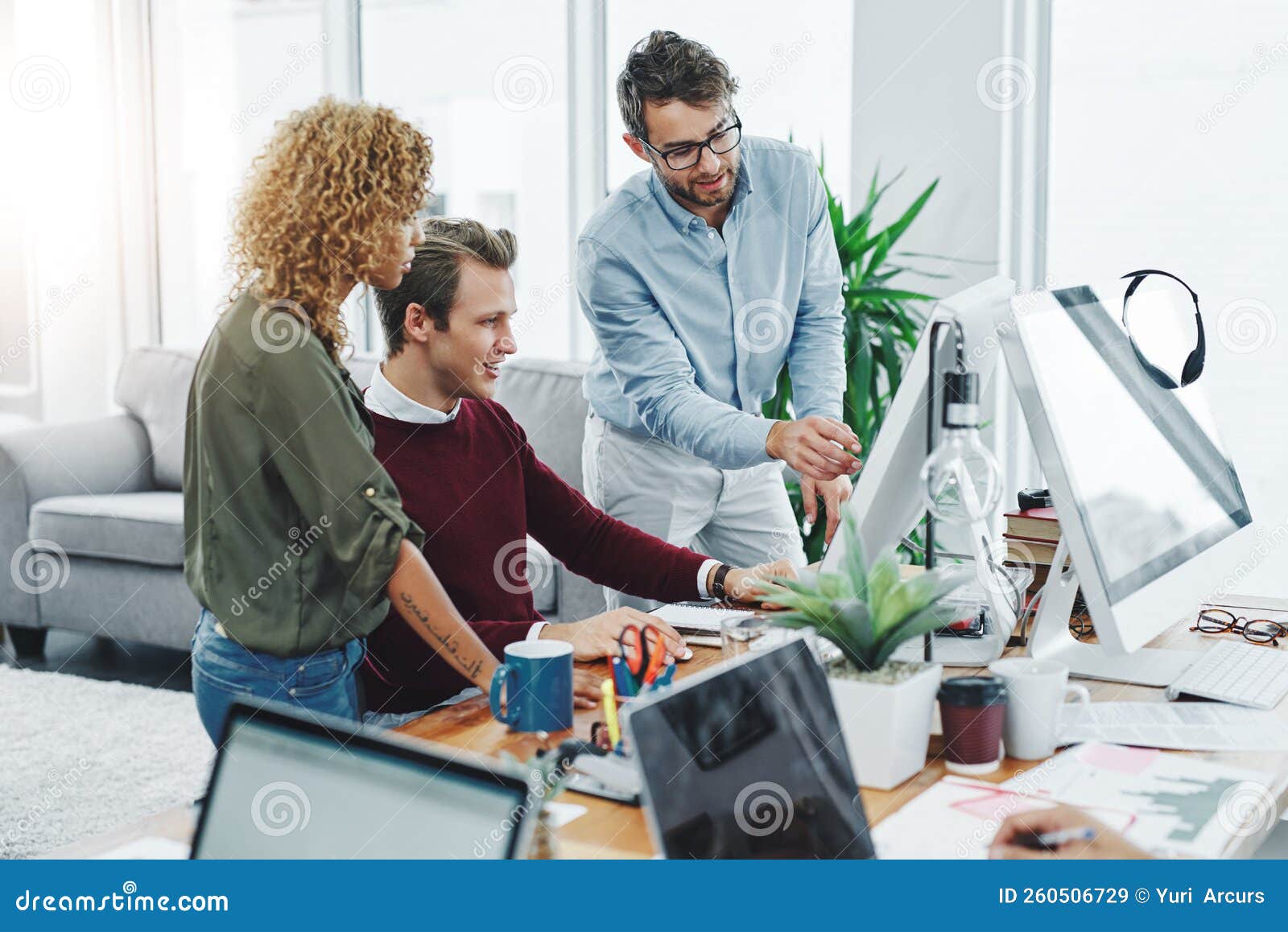 The Connected Team is an Productive Team. a Group of Colleagues Using a ...