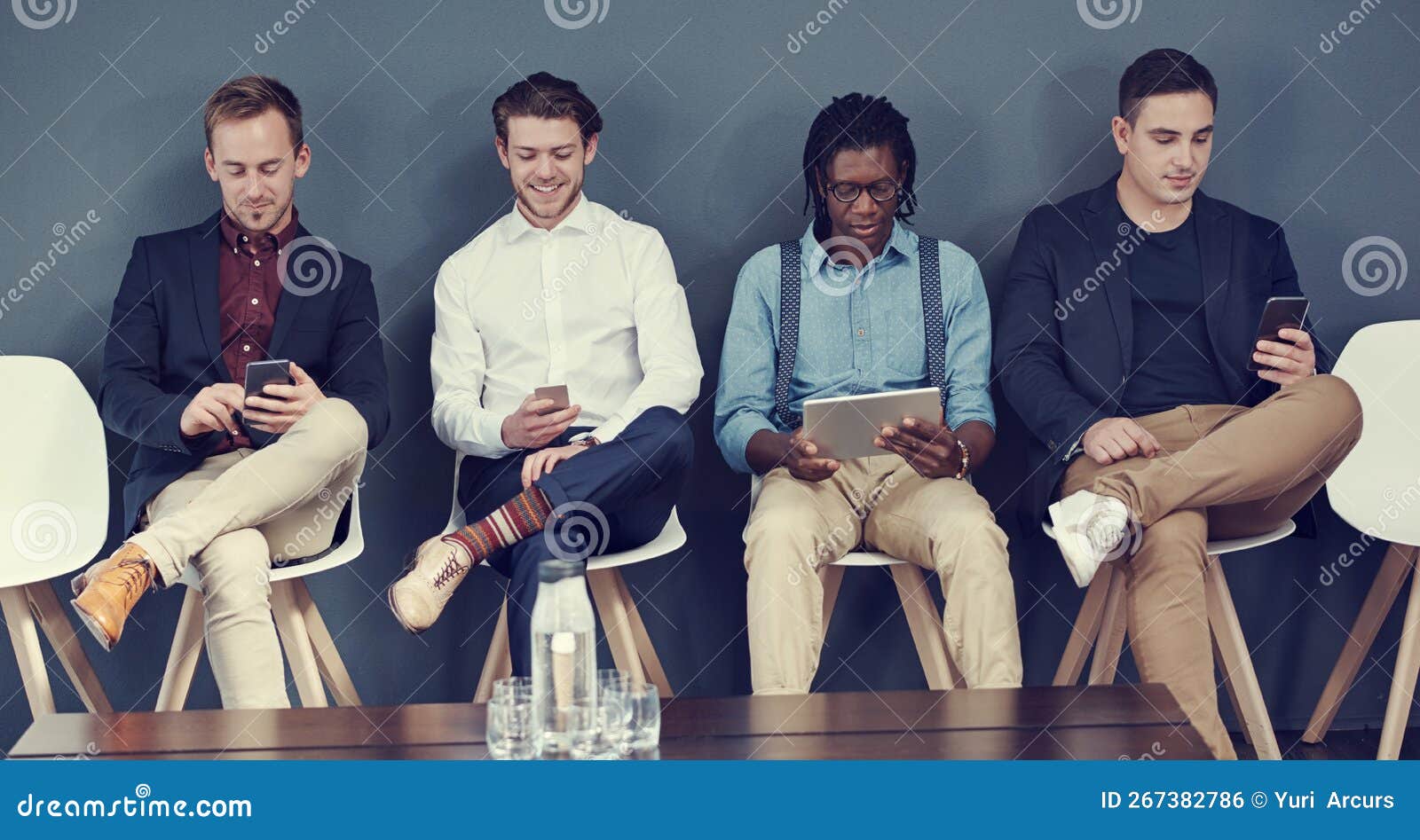 Connected while we Wait. a Group of Businessmen Using Different ...