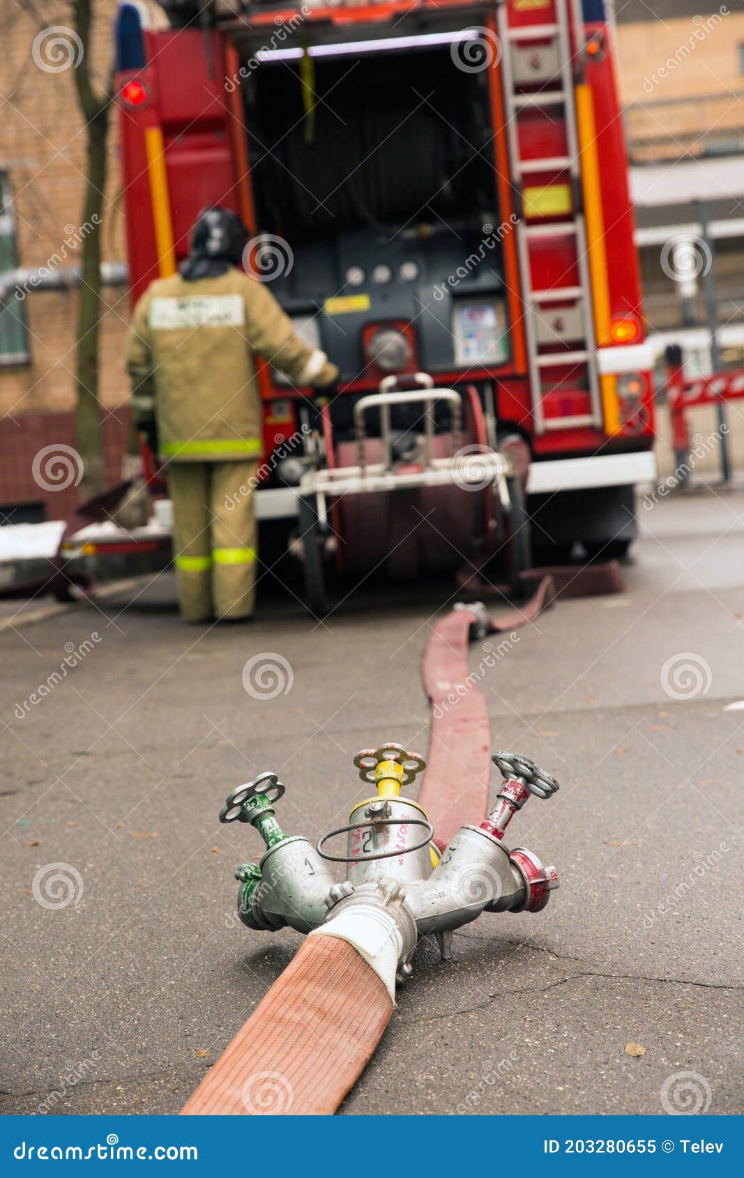 Connecting the fire hose stock image. Image of rescue - 203280655