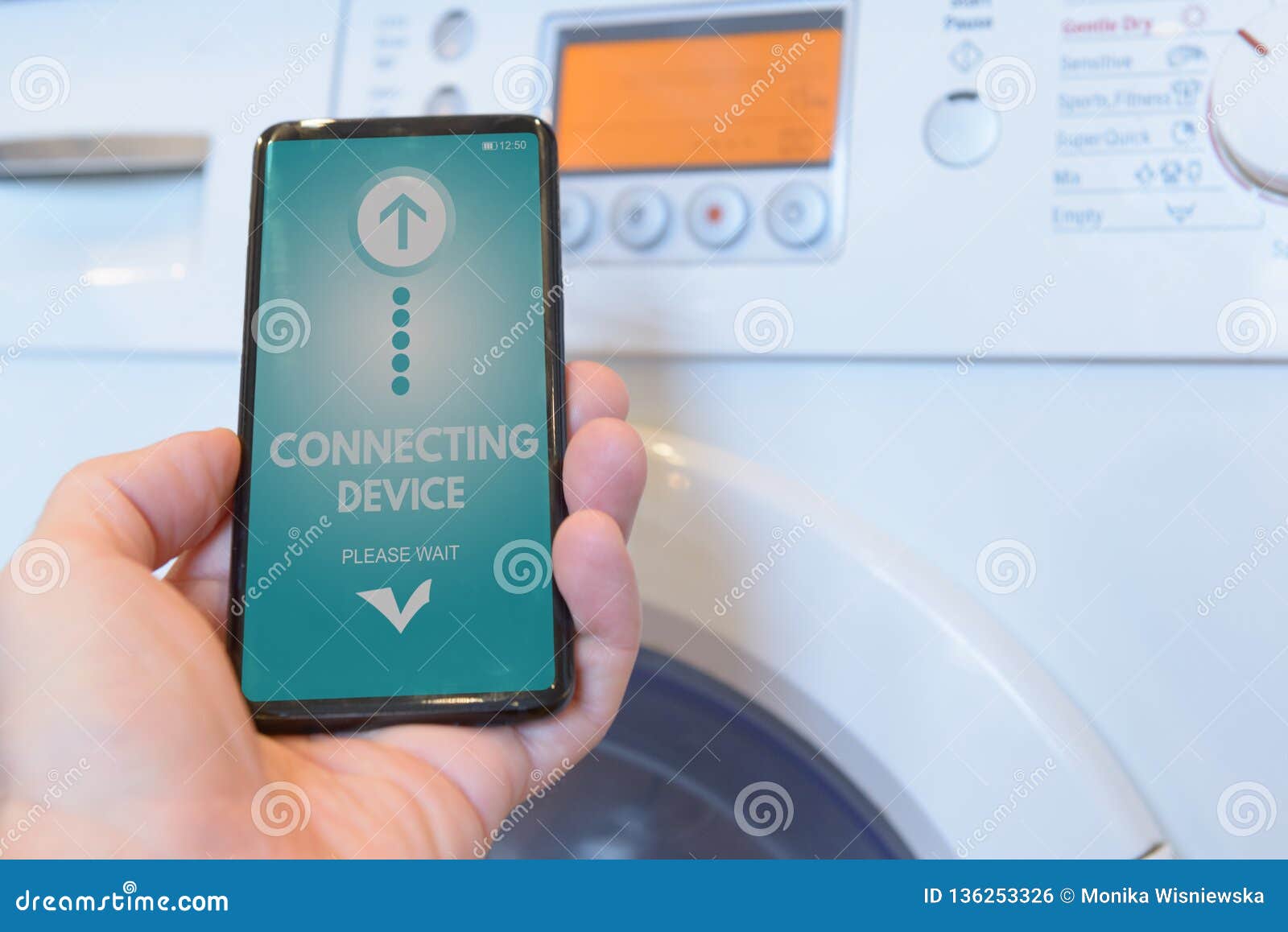 Connecting Washing Machine with Smart Phone Stock Photo - Image of hand ...