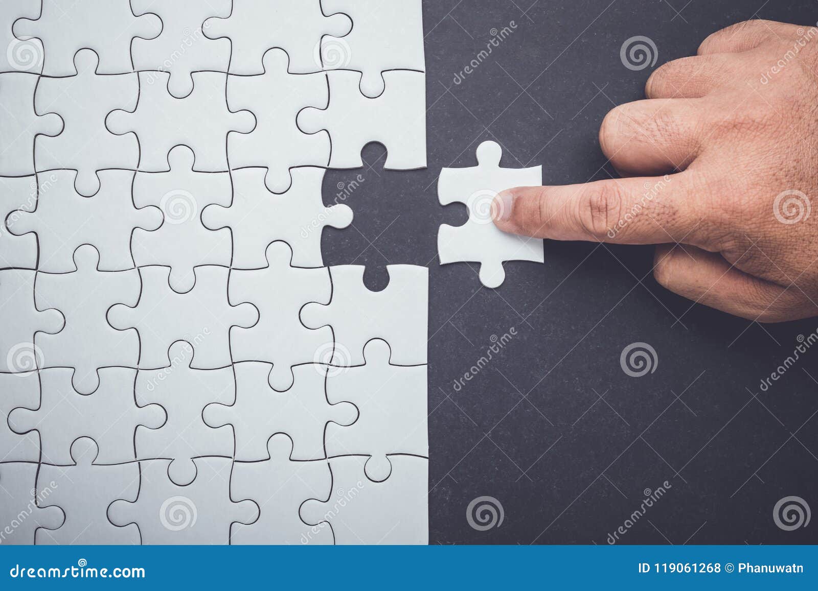Hand Holding Pieces of Jigsaw Puzzle and Insert into the Missing Stock ...