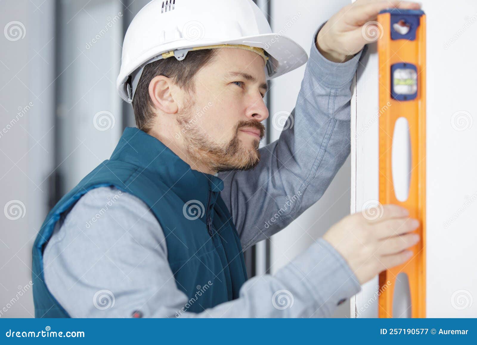 Conscientious Workman Using Spirit Level Stock Image - Image of adult, industry: 257190577