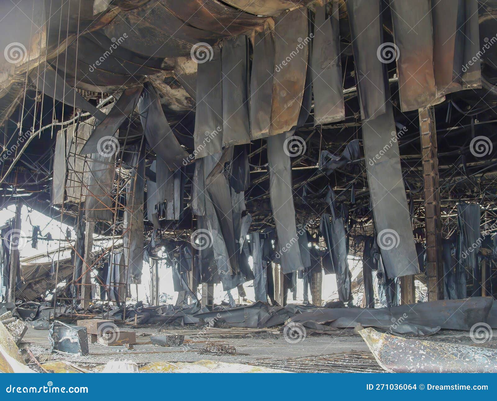 The Consequences of a Fire in a Warehouse, Black Charred Steel Sheets ...