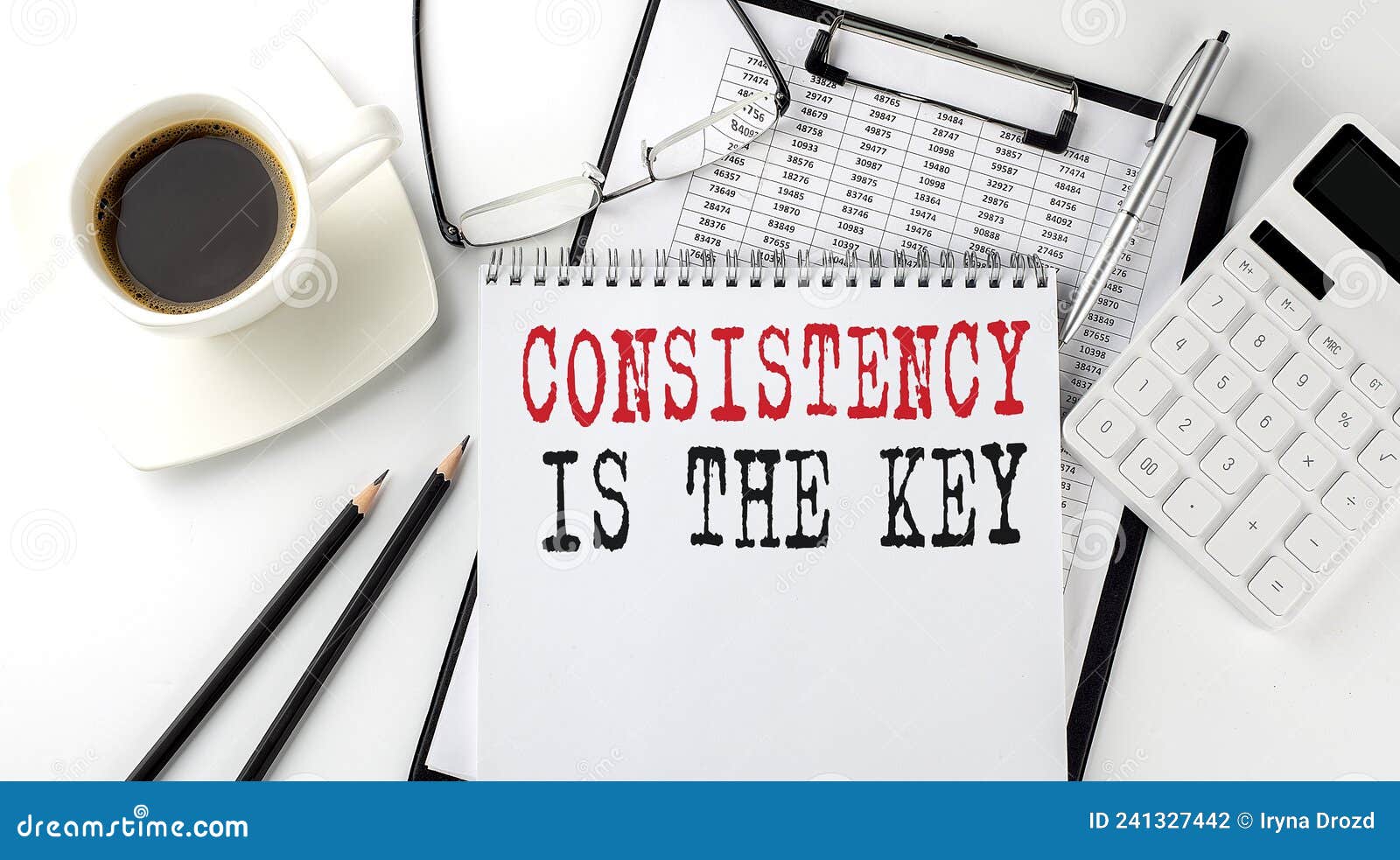 CONSISTENCY is the KEY Text on the Paper with Calculator, Notepad ...