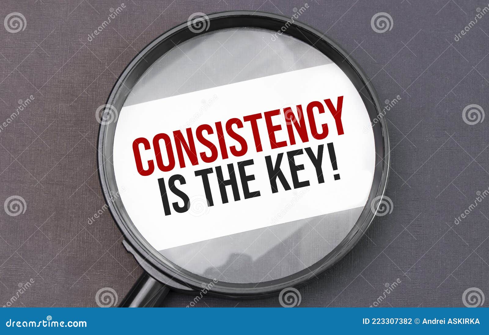 Consistency is the Key Word on Paper through Magnifying Lens Stock ...