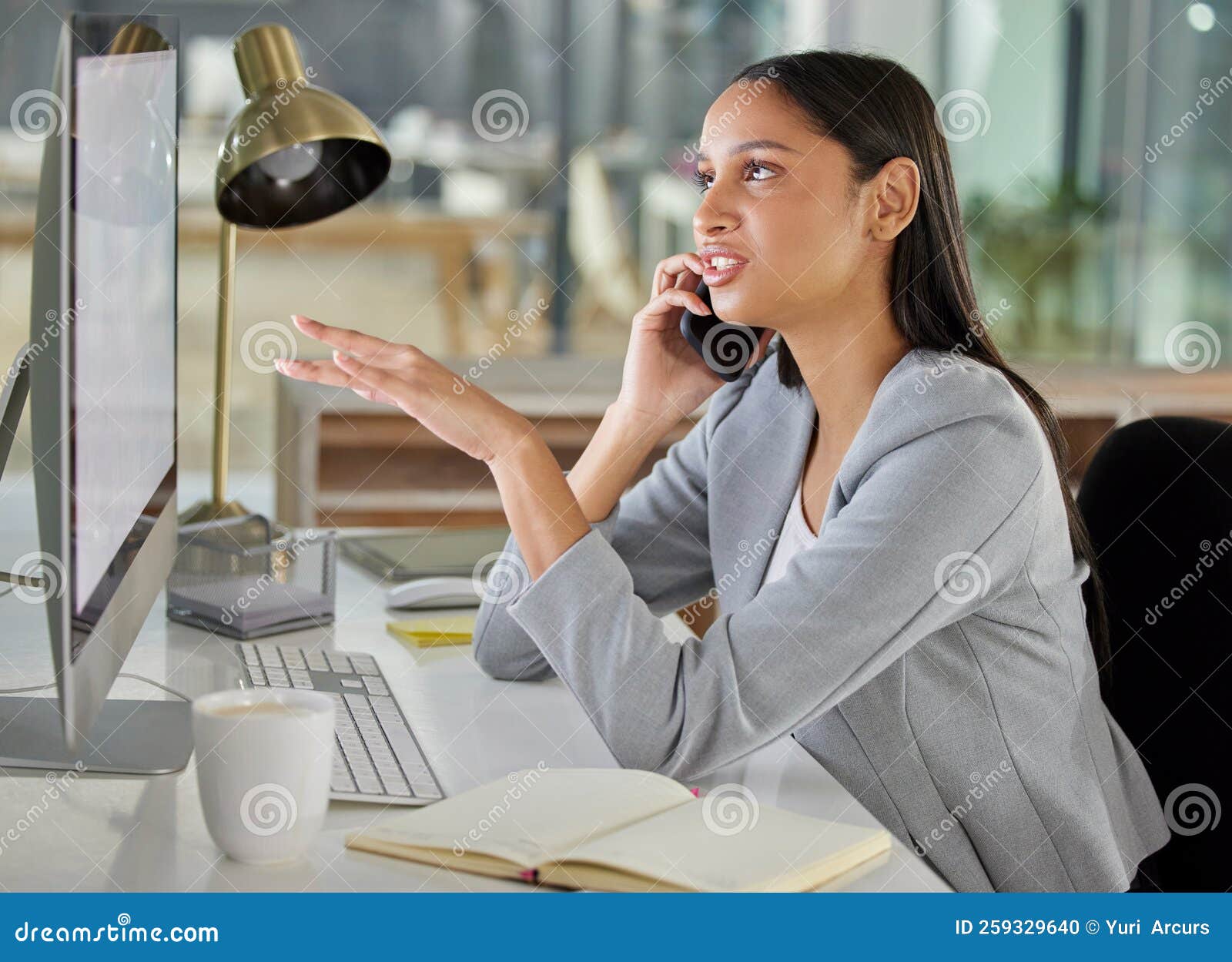 Consistent Work Keeps the Numbers Up. a Young Businesswoman Using a ...