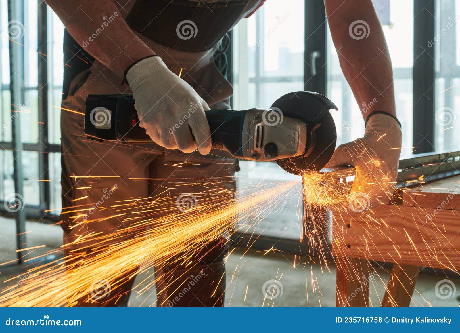 Constructiion Work. Worker Use Angle Grinder for Metal Cutting with ...
