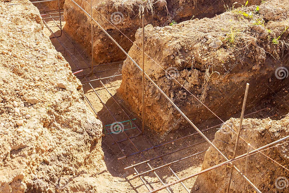 Constructing a Concrete Foundation from Digging an Earthen Trench Stock ...