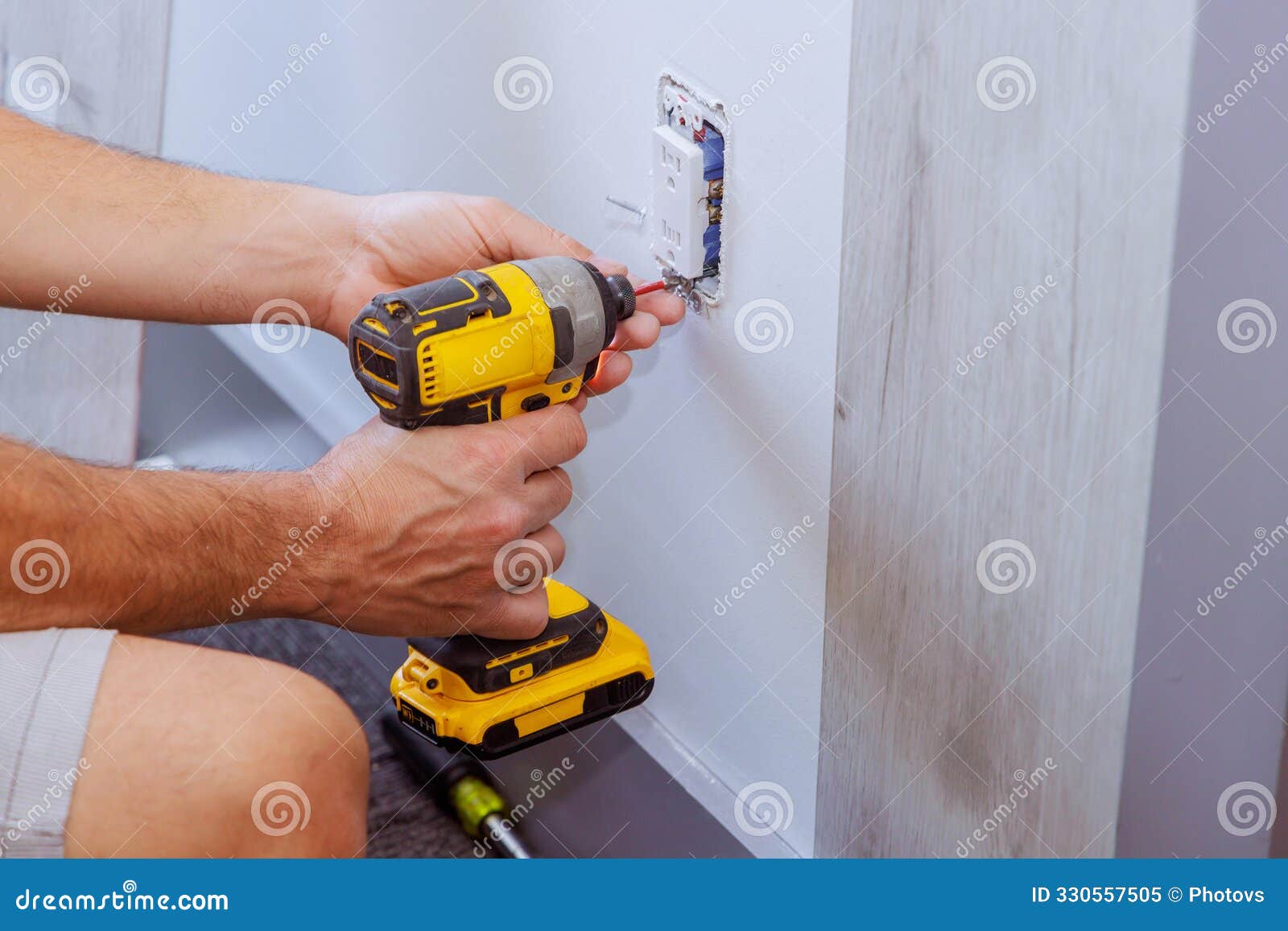 When Constructing a House, Electrician Uses a Screwdriver To Install an ... When Constructing a House, Electrician Uses a Screwdriver To Install an ...
