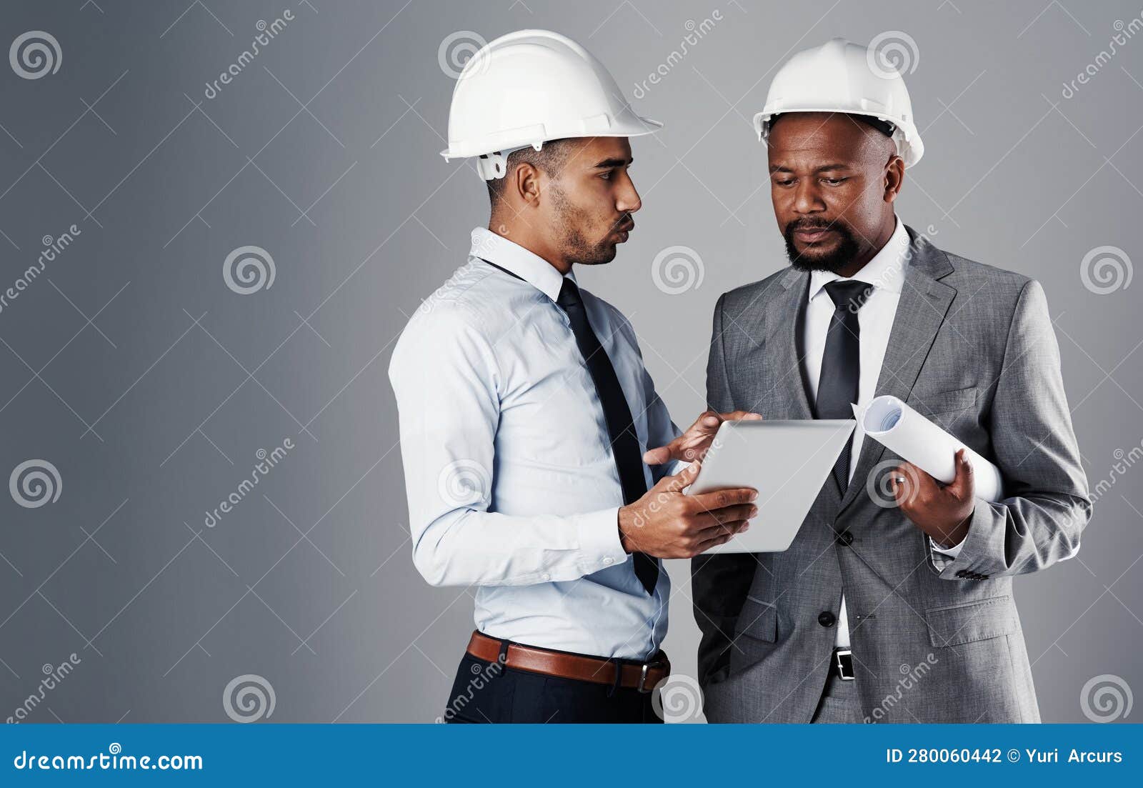 Constructing Their Success. Two Civil Engineers Discussing Building ...