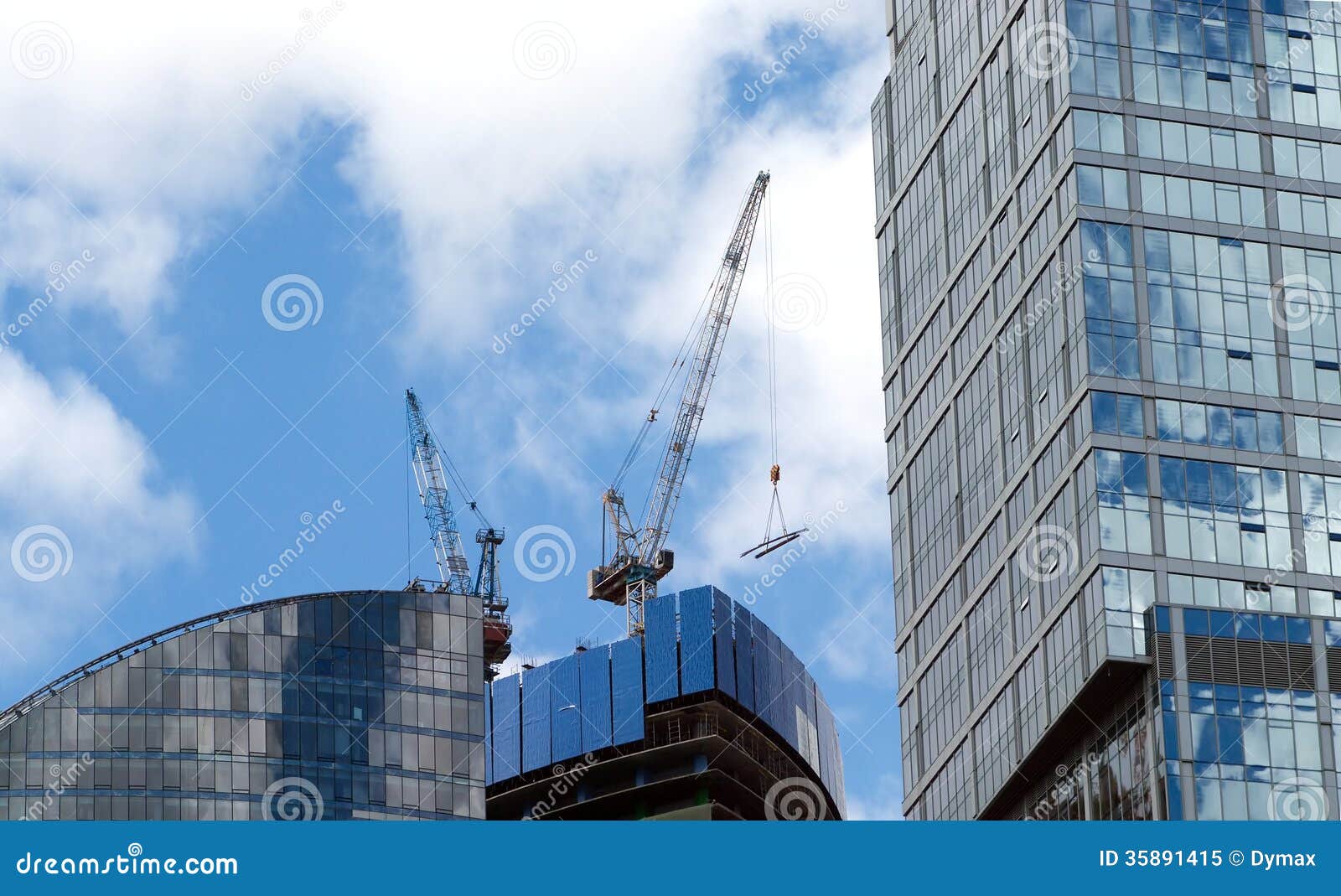Tower Hoisting Crane Elevate Panels At Construction Process On Top Of ...