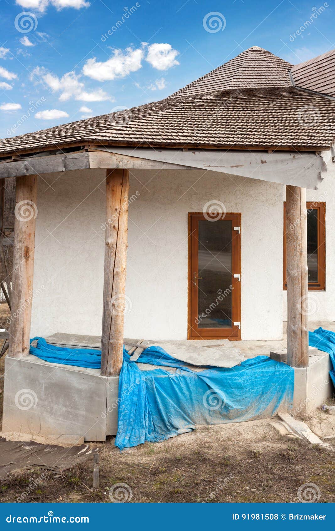 Construction of Adobe House with Thatched Roof and Plastic Windows ...