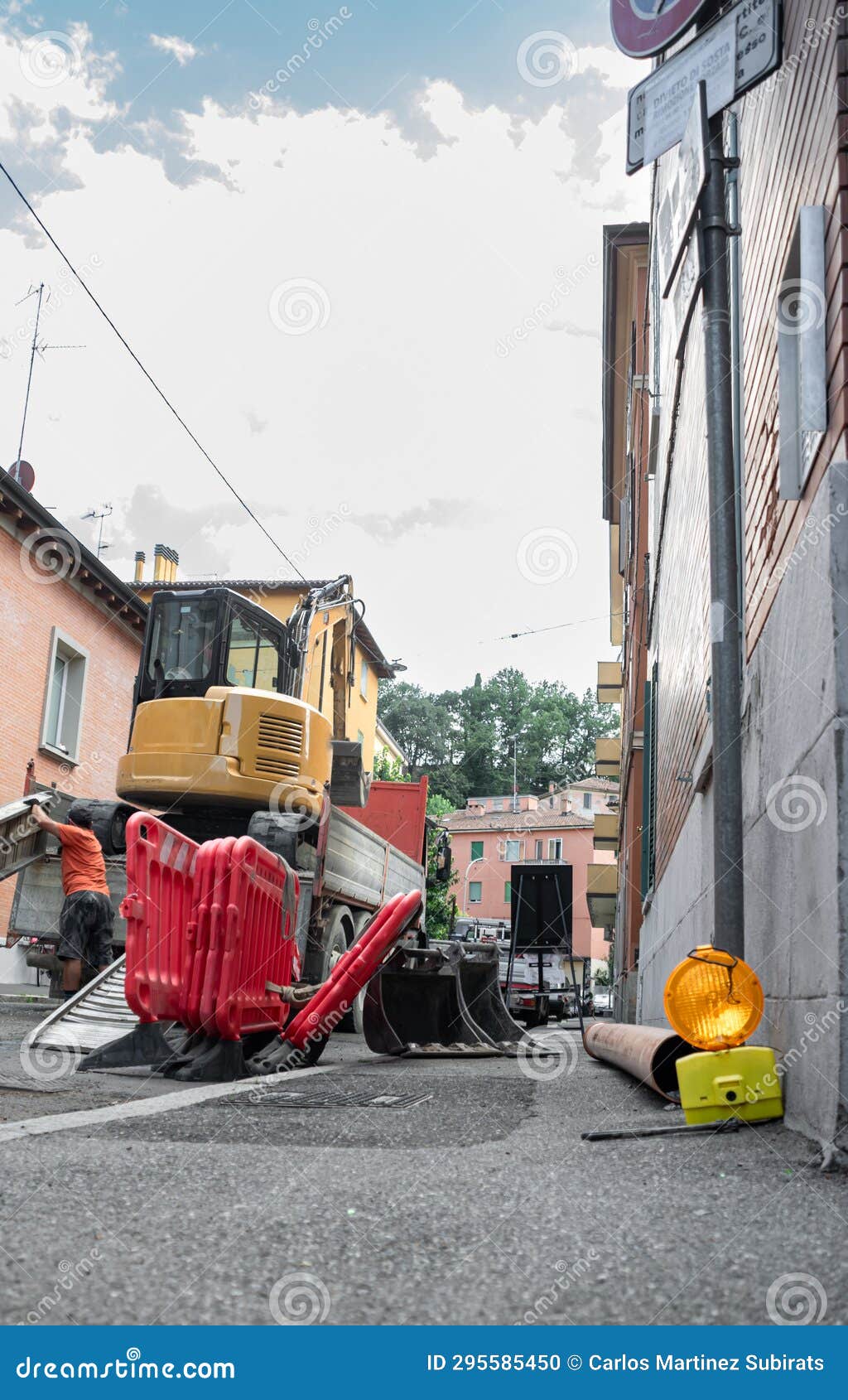 Construction Area with Operators Deploying Barrier, Excavator and ...