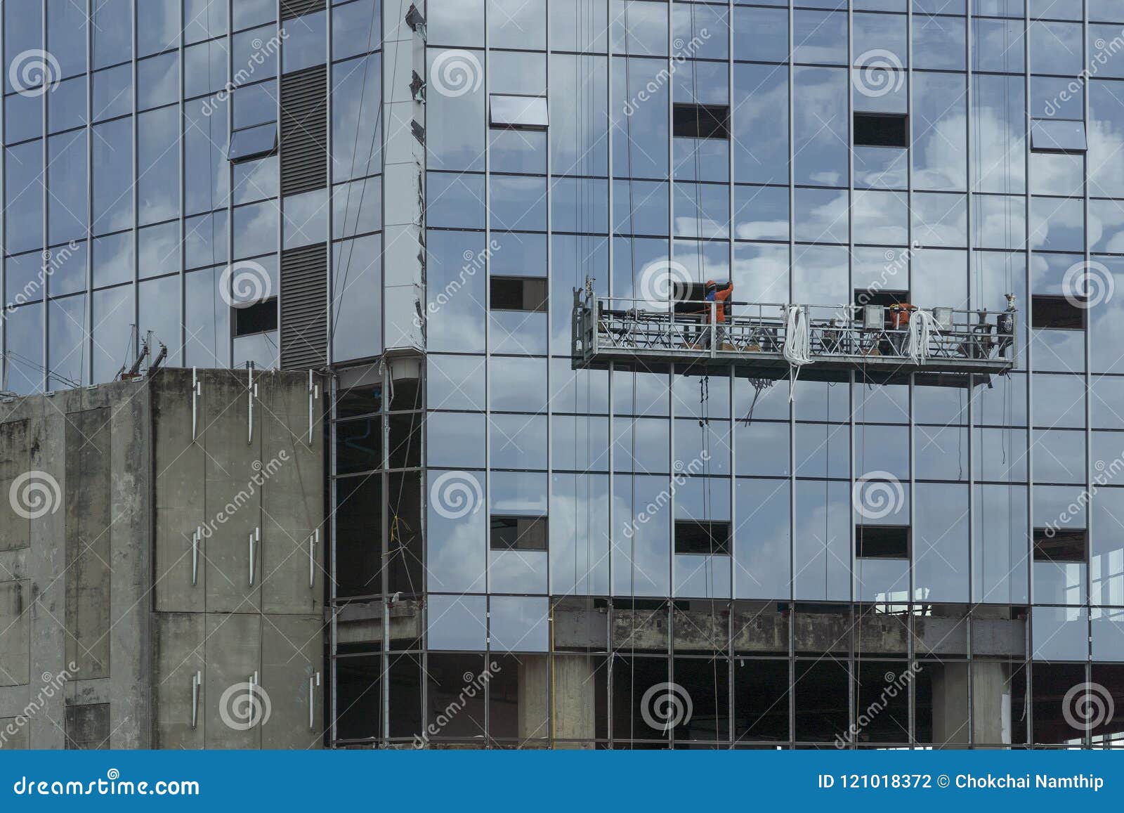 Construction Baskets Blue Next To the Building with Workers Stock Photo ...