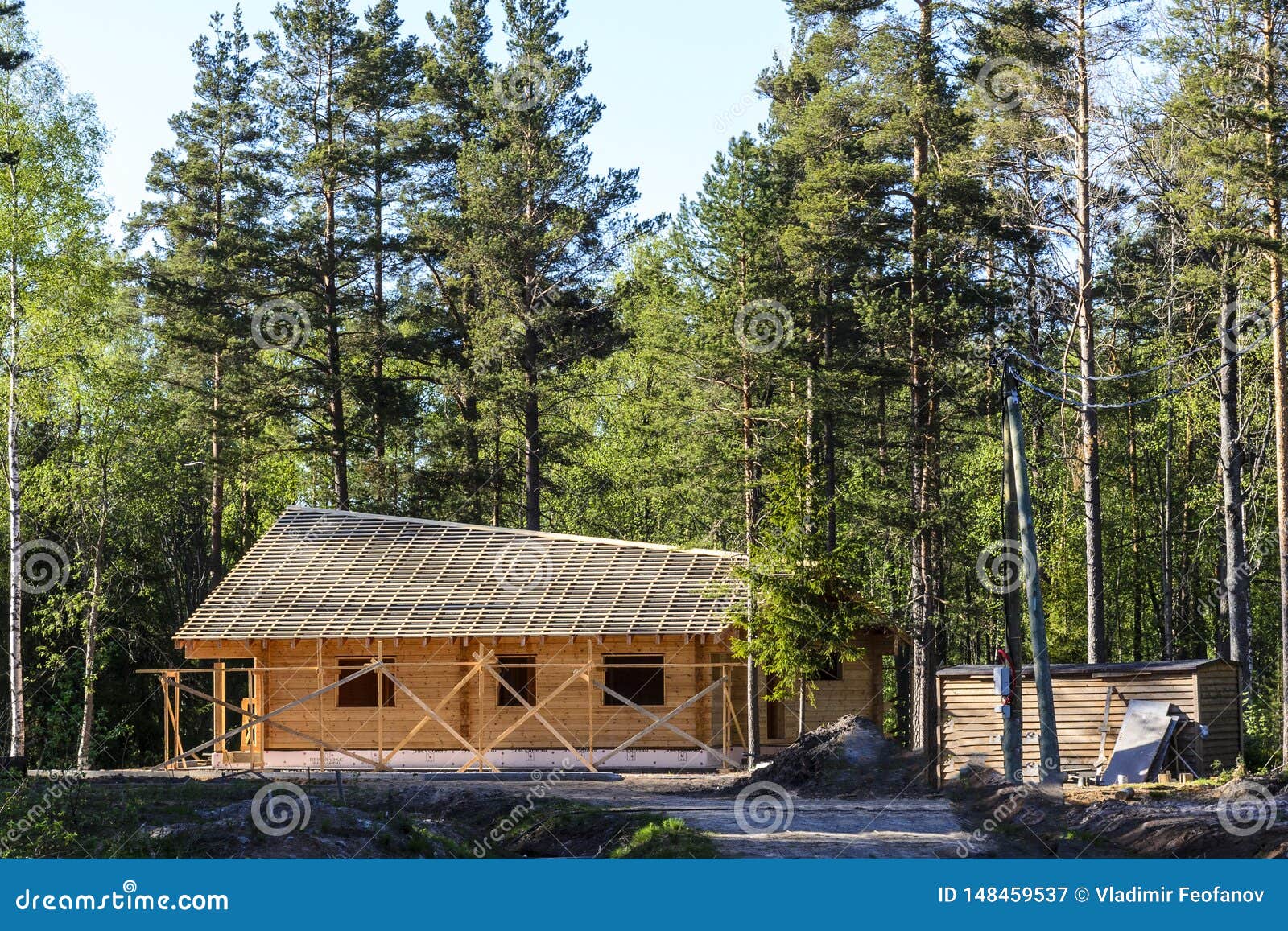 Construction of a Beautiful House Made of Timber, Harmoniously Fitting ...