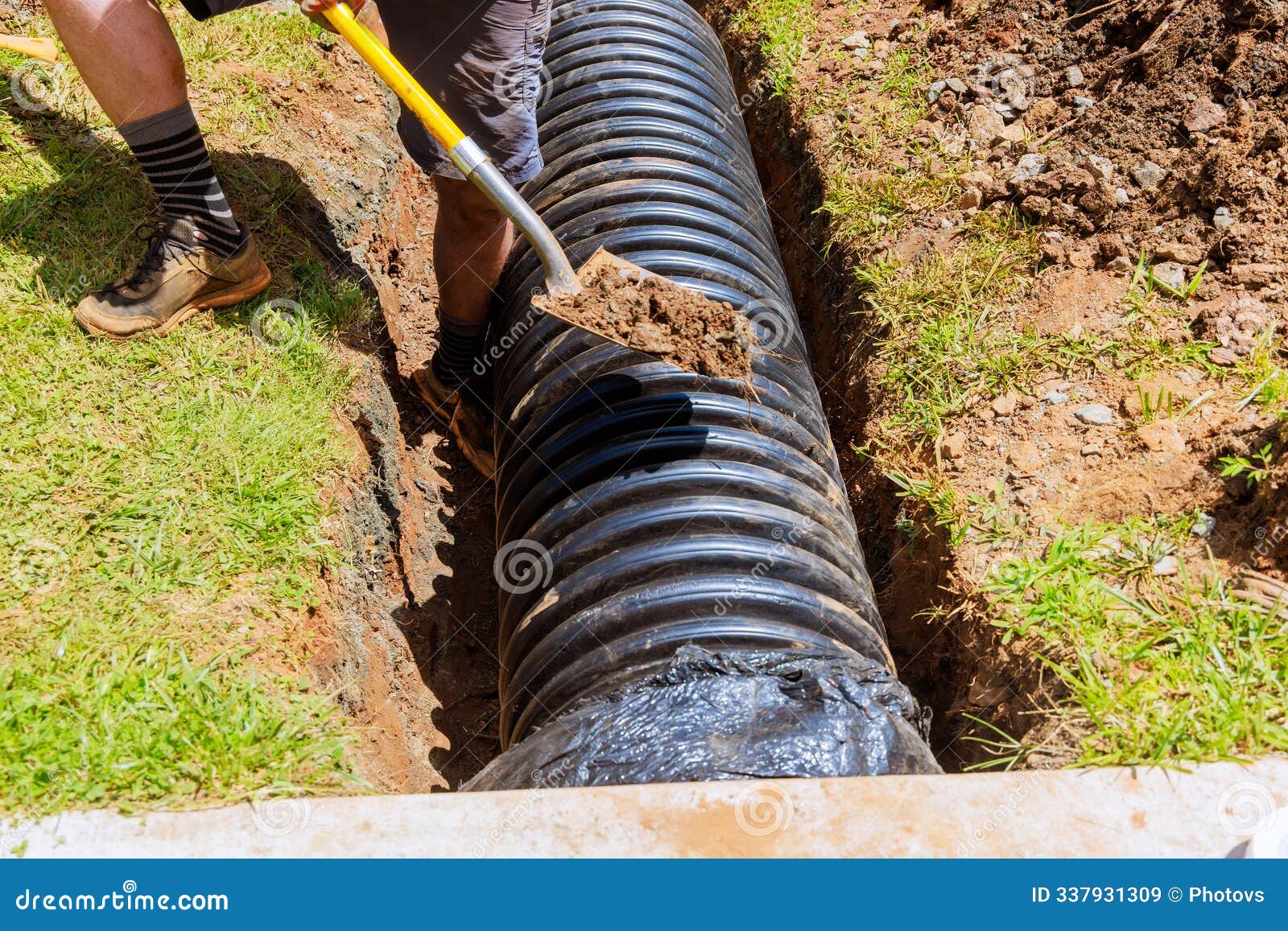 During Construction, Black Drainage Pipes are Installed in a Trenches ...