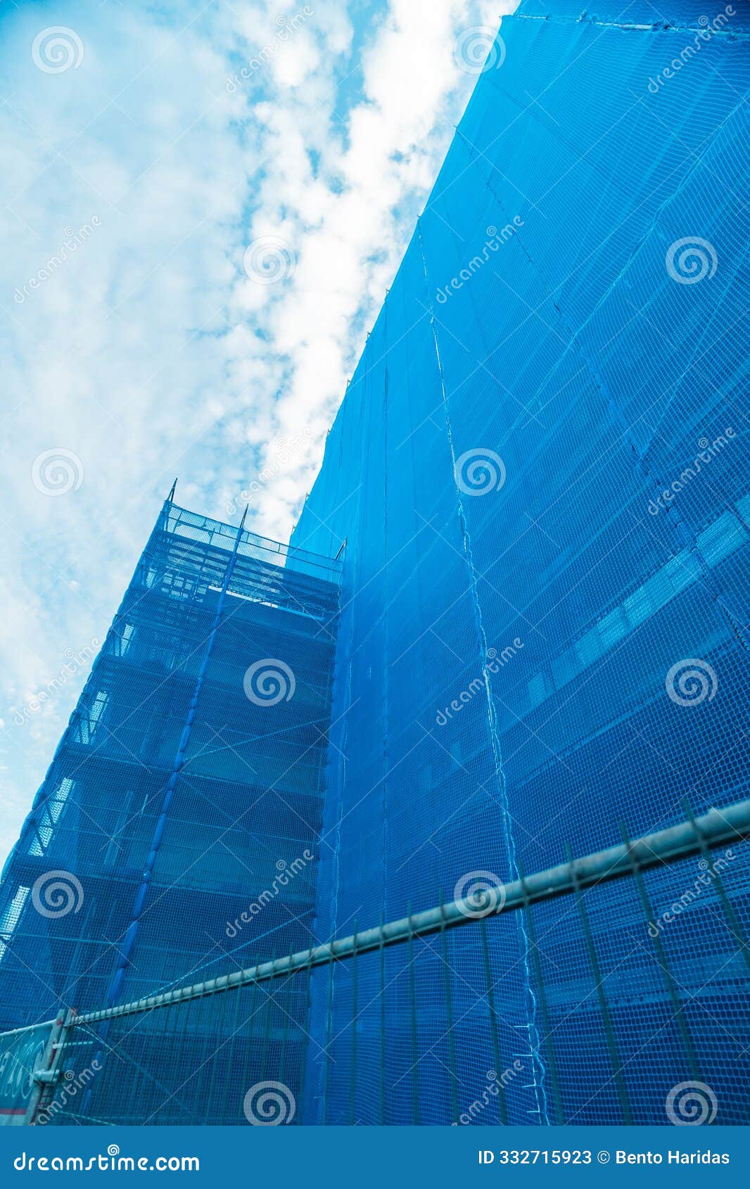 Construction with Blue Scaffolding on a Exterior Facade of a Building ...