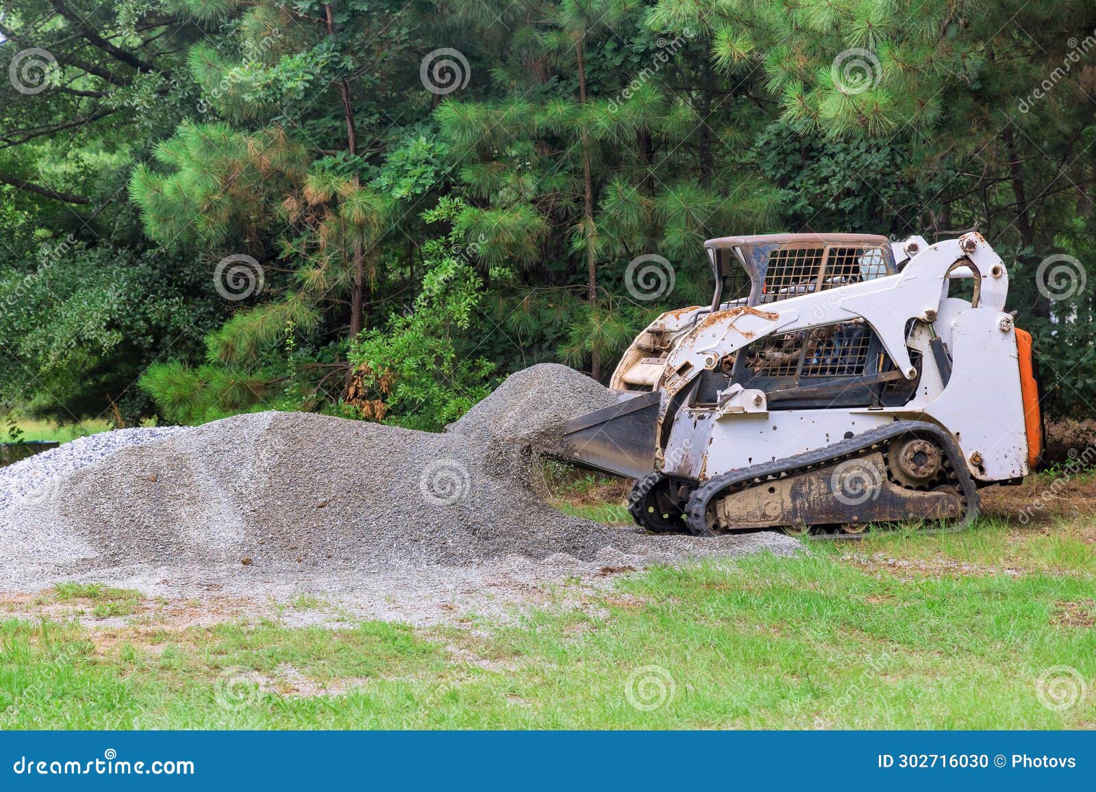 During Construction, Bobcat Mini Loader is Moving Bucket Containing ...