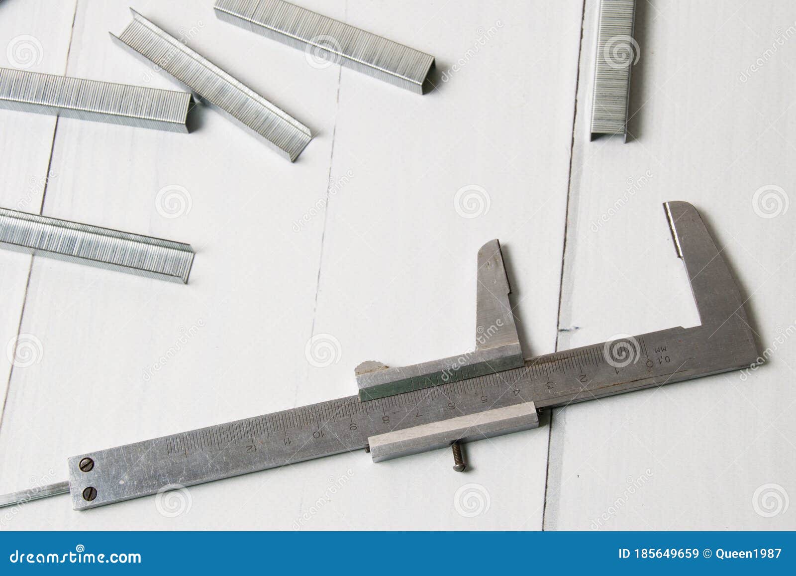Construction Brackets and Ruler on a Light Wooden Background with Copy ...