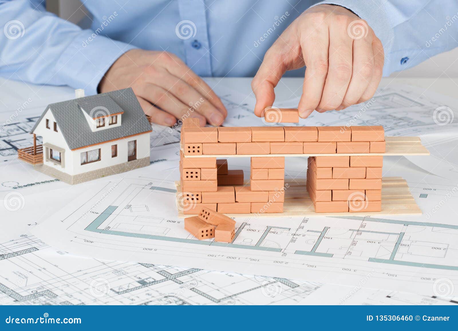 Construction with Brick on Blueprint Stock Photo - Image of drawing ...