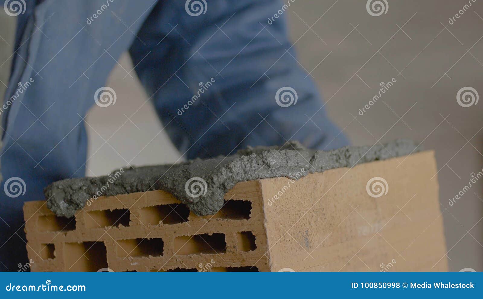 Construction of Brick Wall. Trowel Spreading Cement on Bricks Stock ...