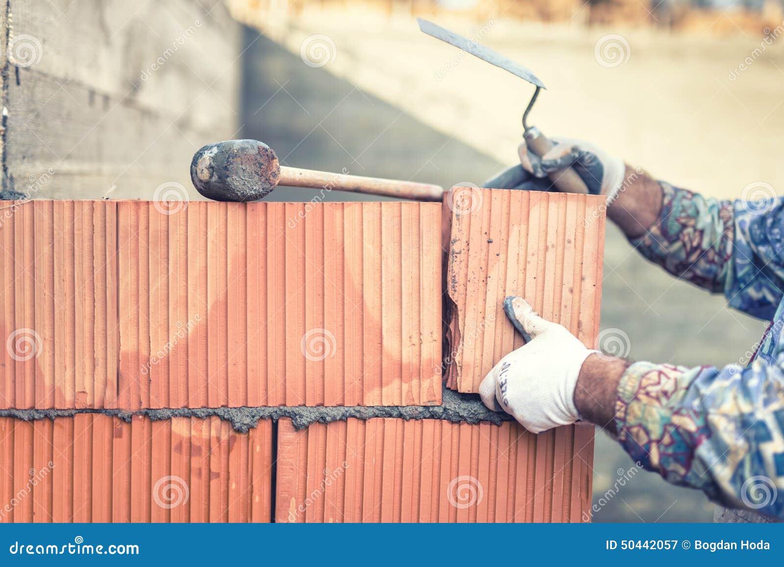 Construction Bricklayer Worker Building Walls with Bricks and Mortar ...