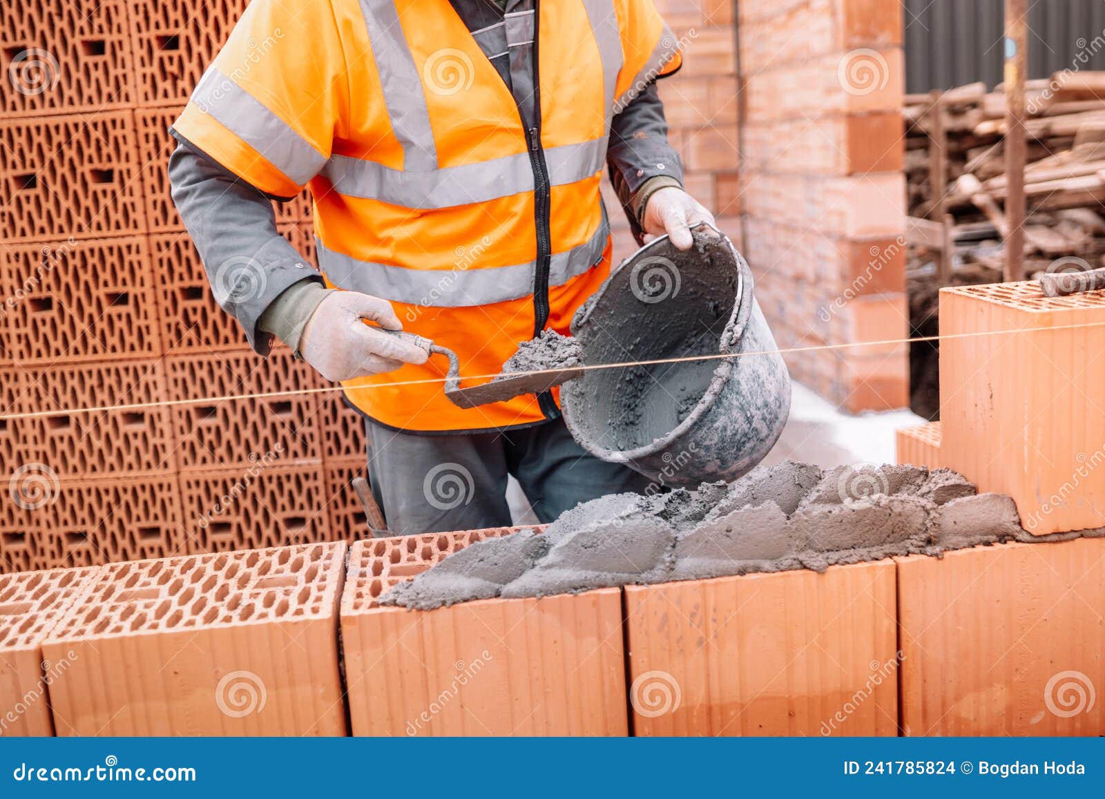 Construction Bricklayer Worker Building Walls with Bricks, Mortar and ...