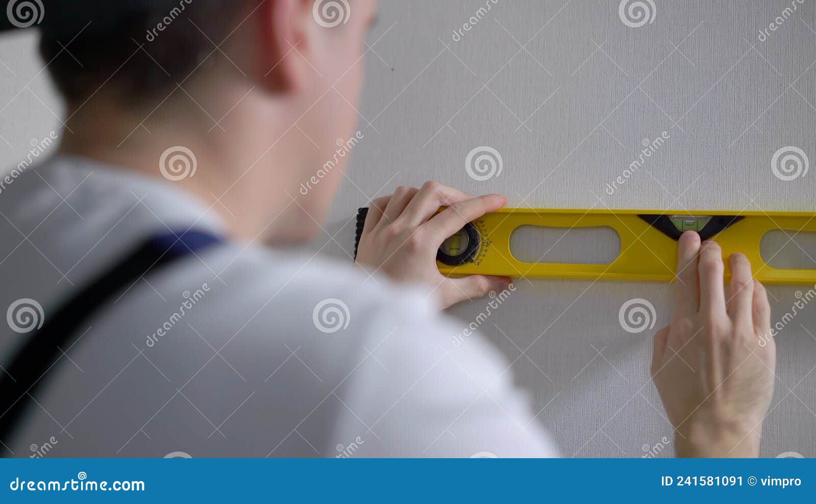 Construction Bubble Level. Builder Worker Makes Repairs in the ...