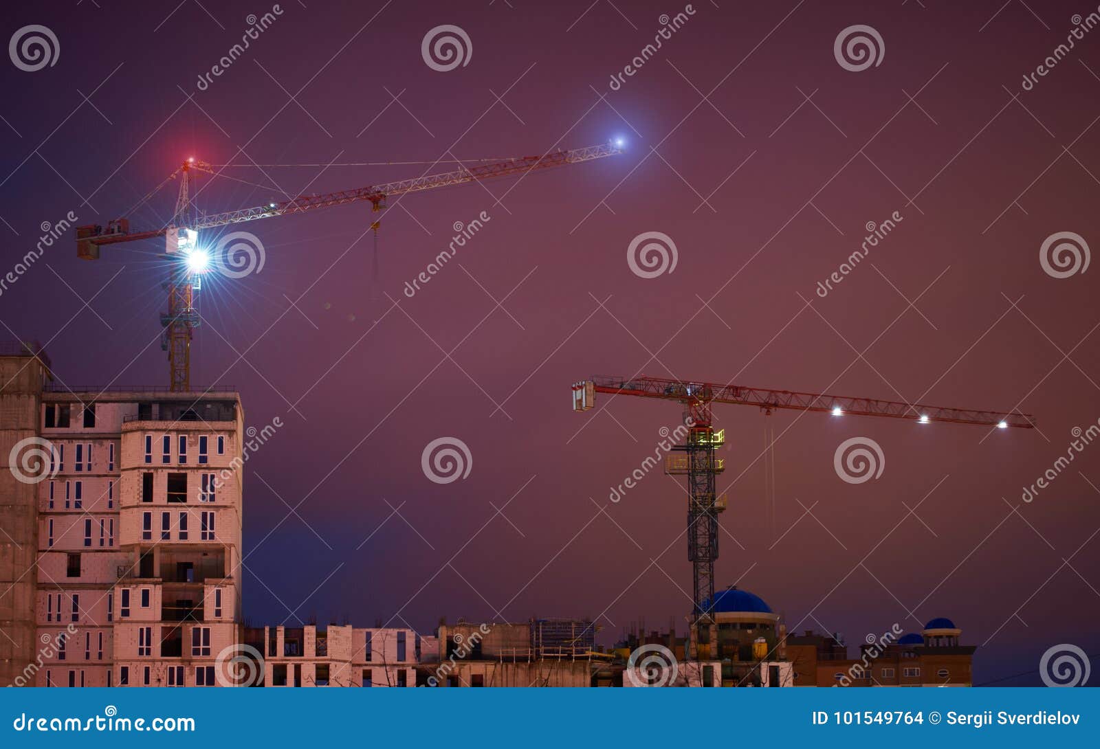Construction of a Building by Cranes at Night Stock Photo - Image of ...