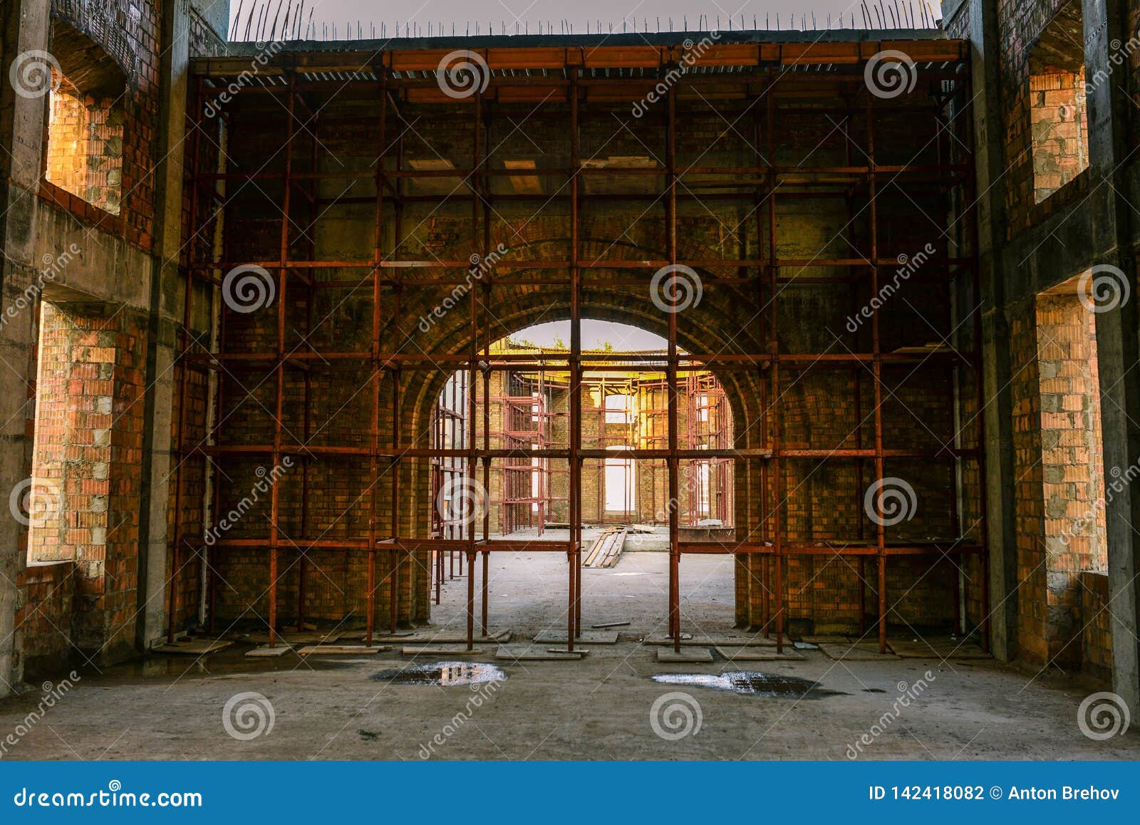 Construction of the Building. Large Arch of Brick. Building Scaffolding ...