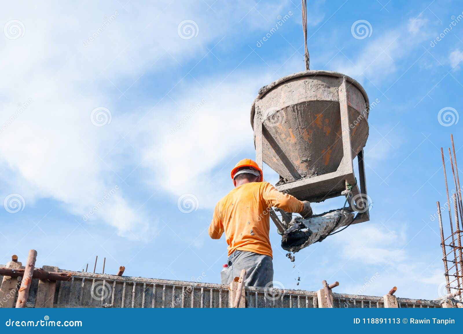 Construction Building Workers at Construction Site Pouring Concrete in ...