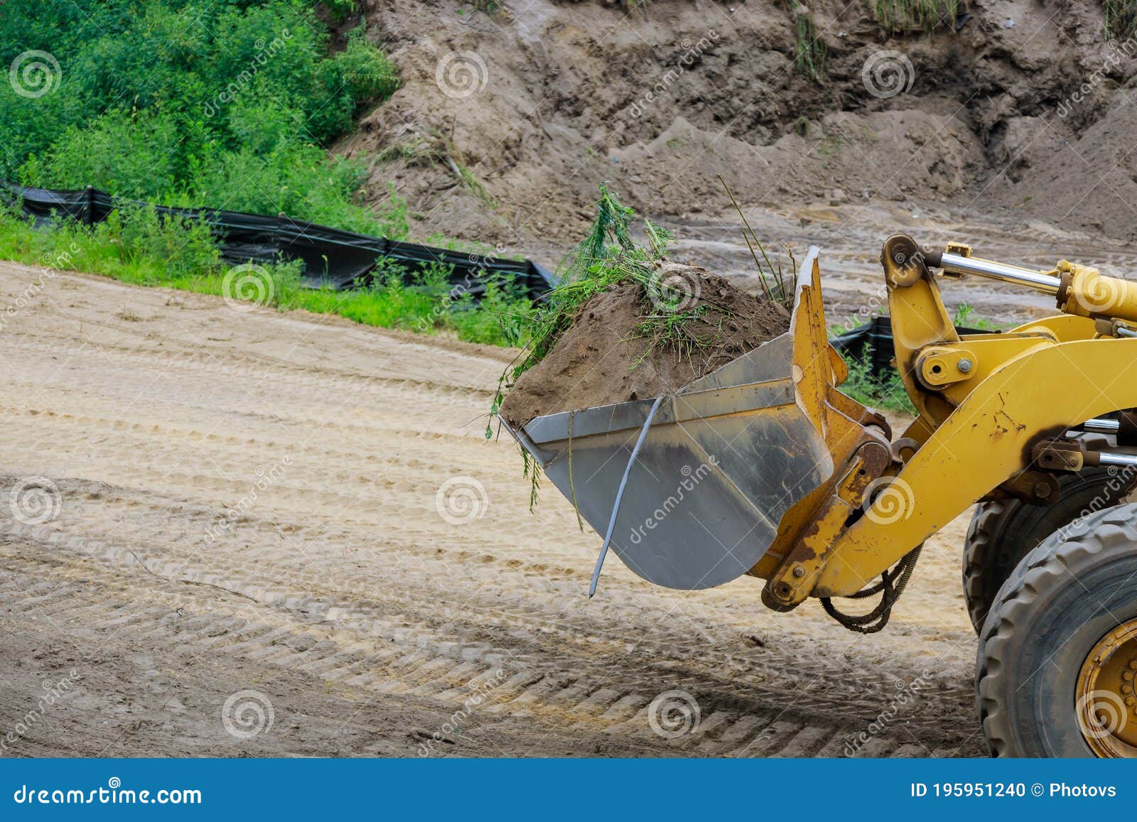 Construction Bulldozer Soil Digging Ground Landscaping Works on the ...