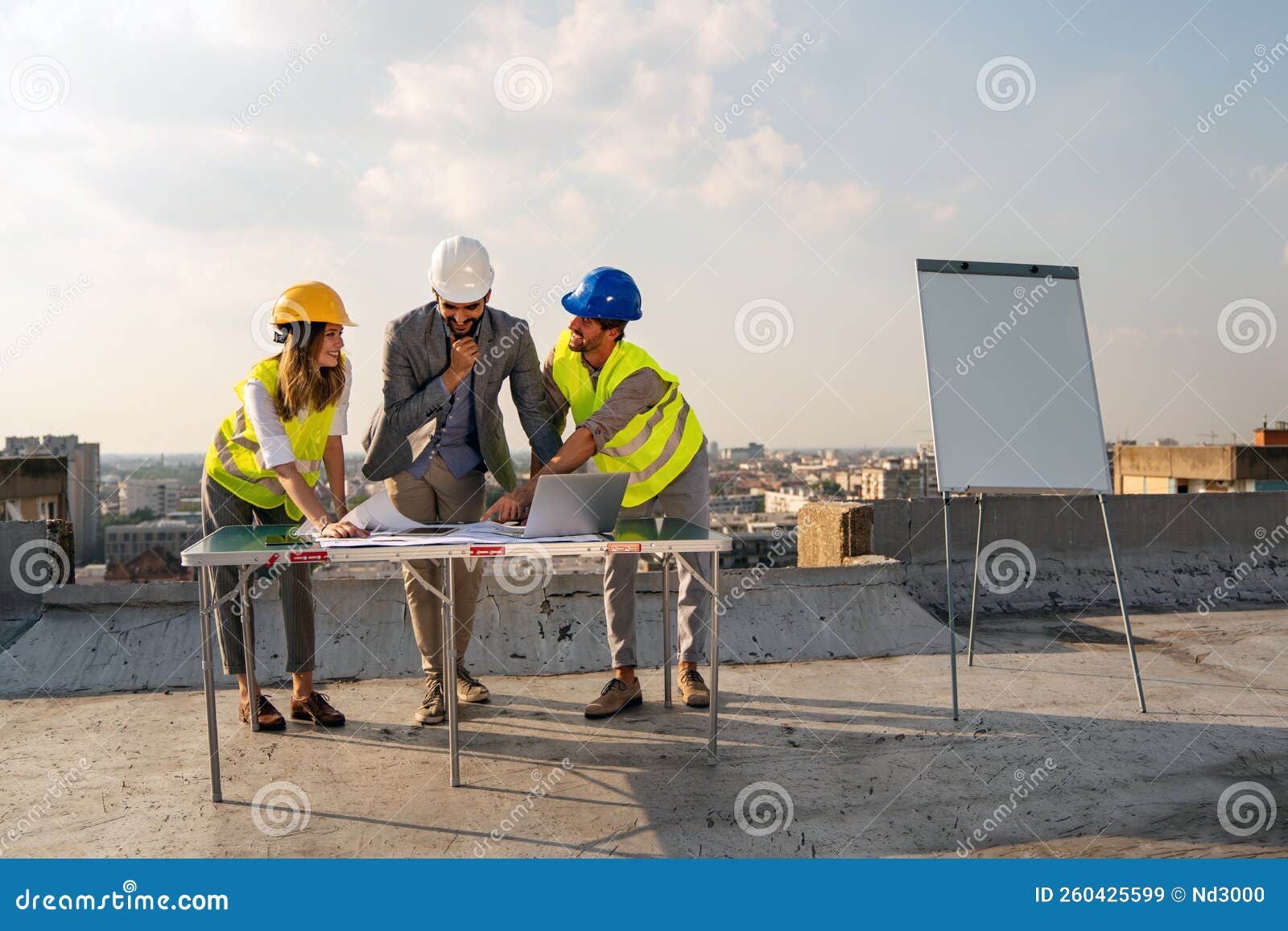 Construction Concept. Engineers and Architects Working at Construction Site with Blueprint Stock ...