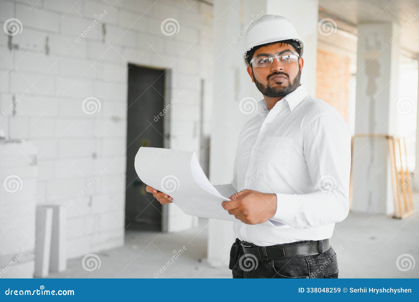 Construction Concept. Portrait of a Young Architect at a Construction ...